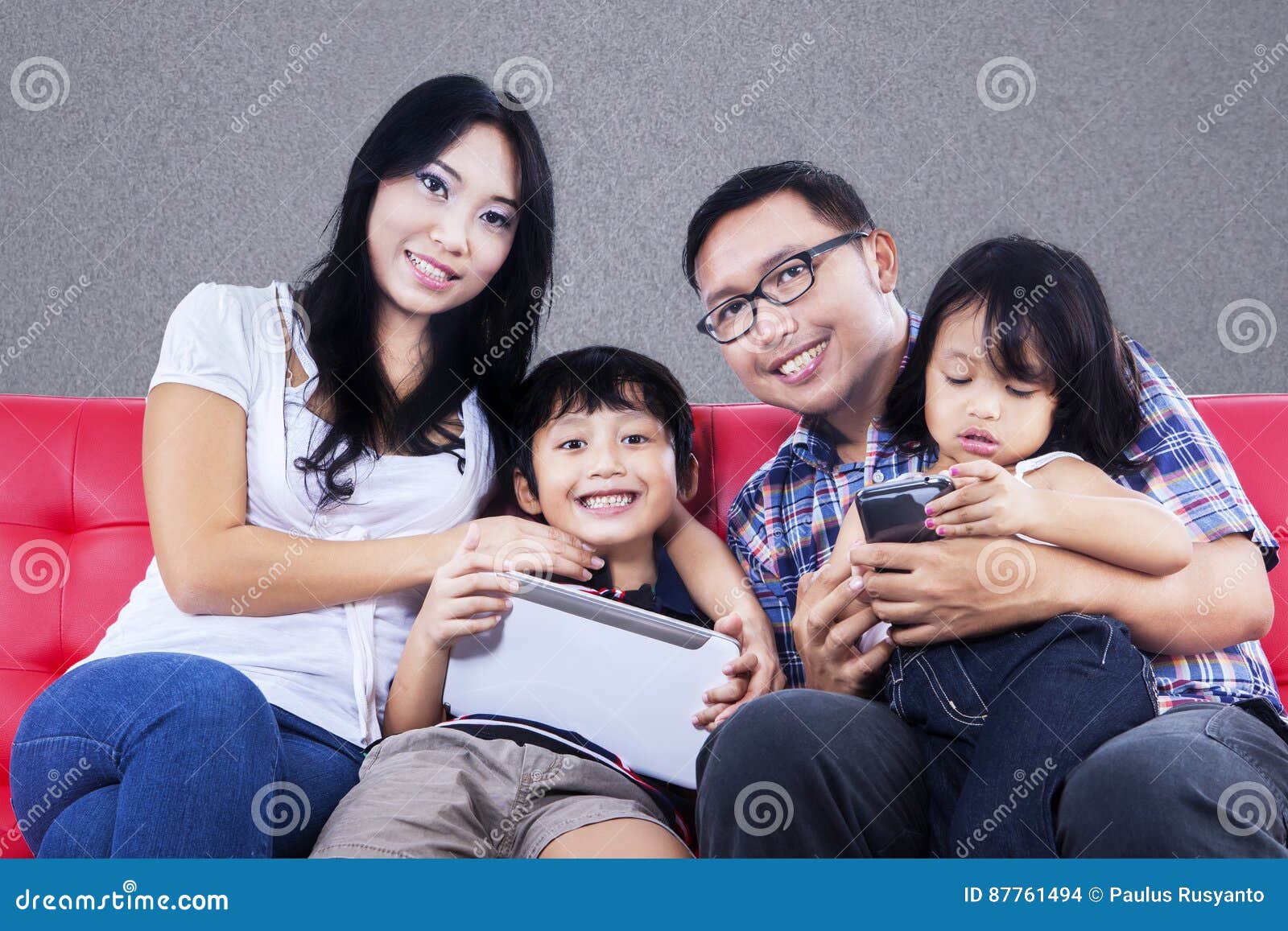 Happy Family Red Sofa Grey Background Stock Photos - Free & Royalty ...