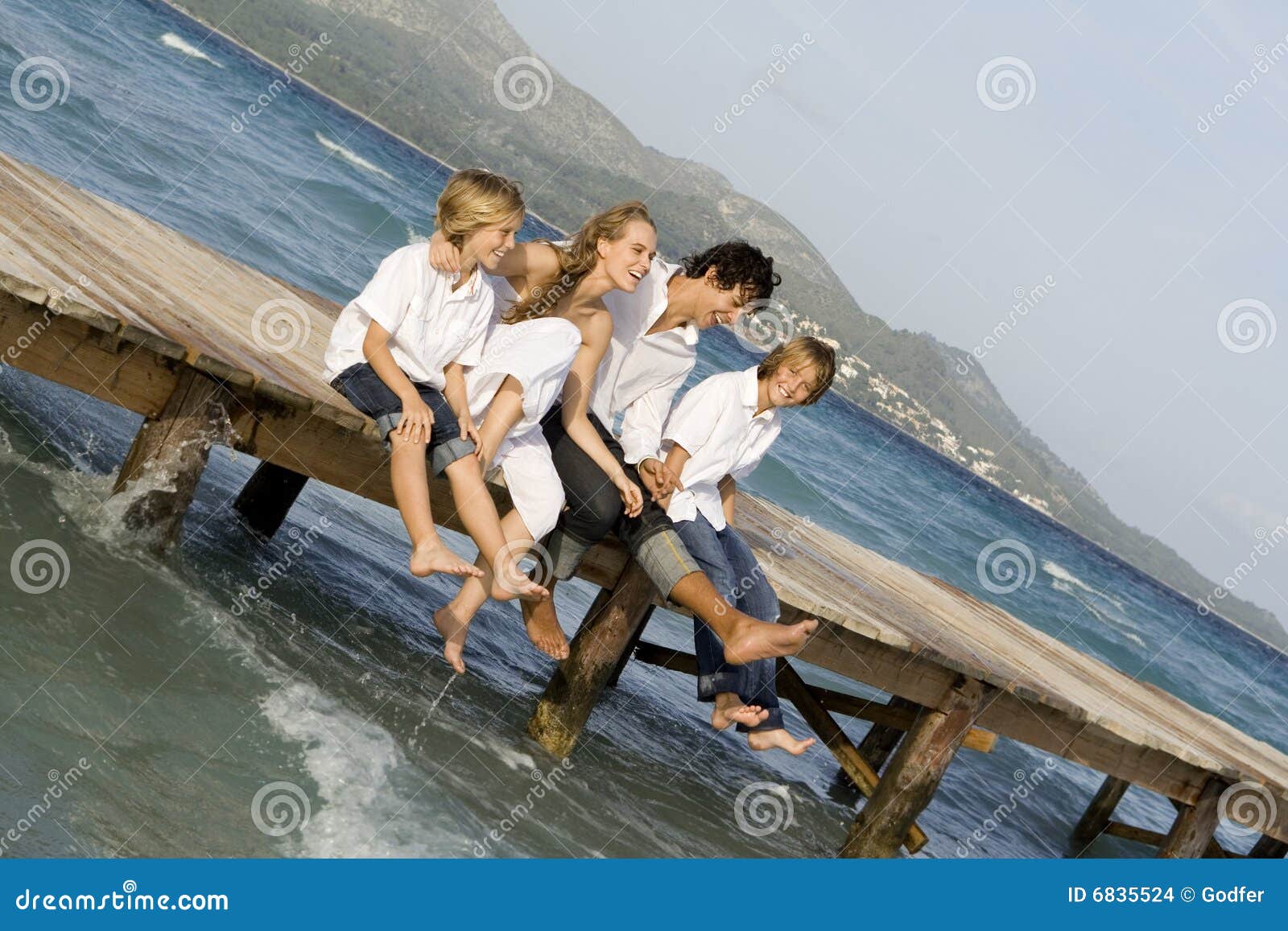 Happy Family Relaxing on Vacation Stock Photo - Image of sitting ...
