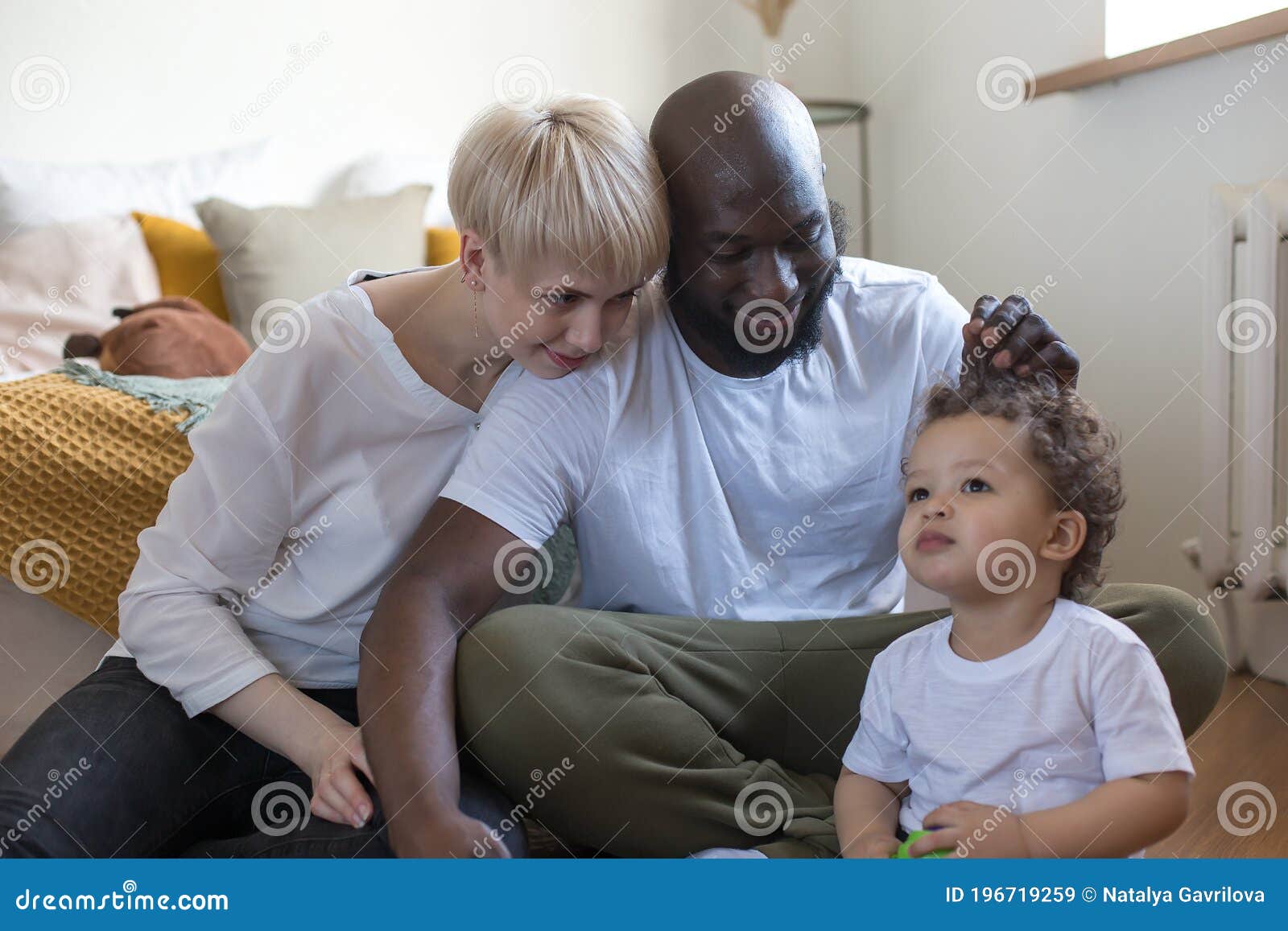 Happy Family Resting at Home, a Multicultural Family Stock Image ...