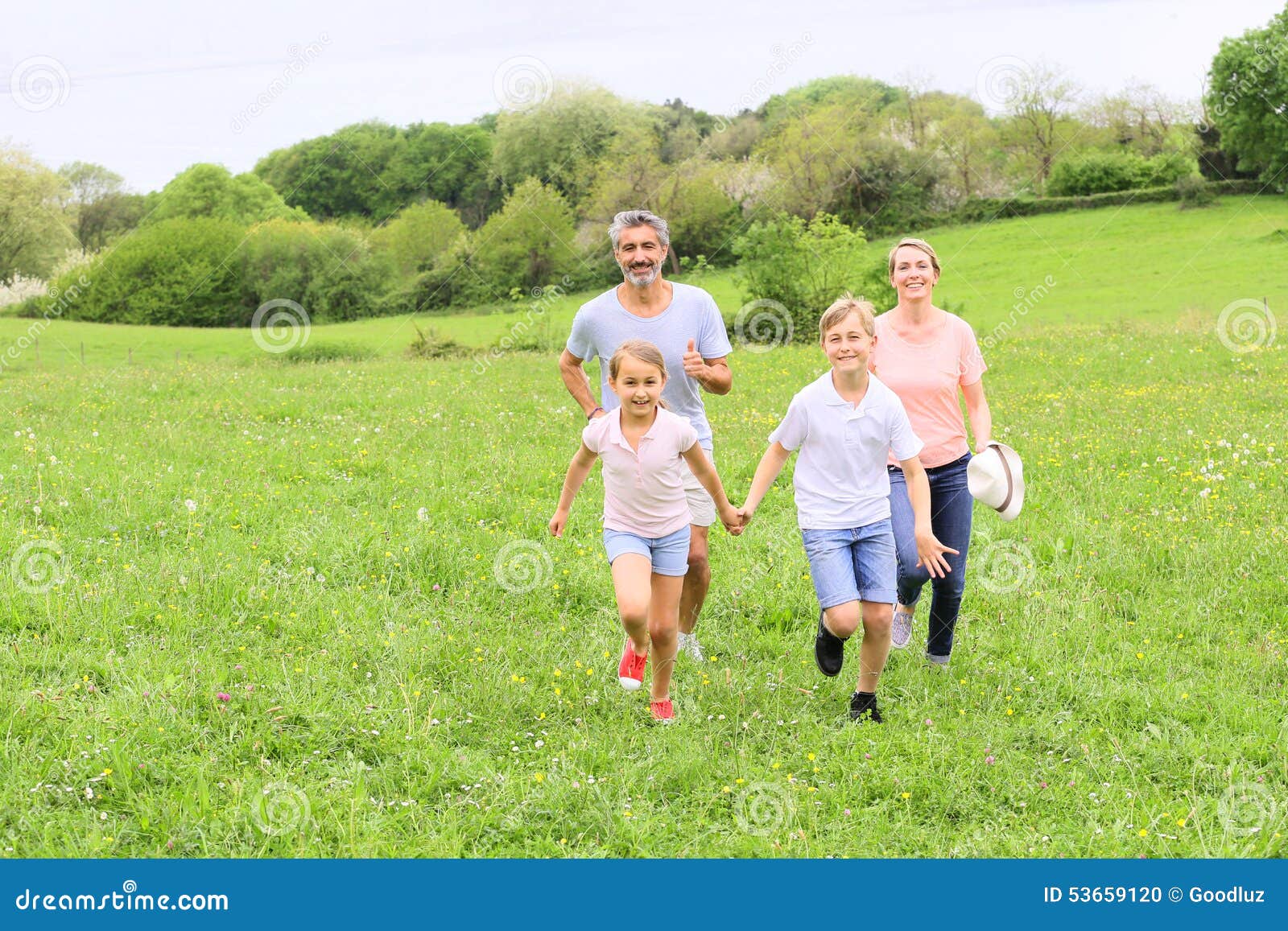 Happy Family Running in the Fields Stock Photo - Image of nature ...