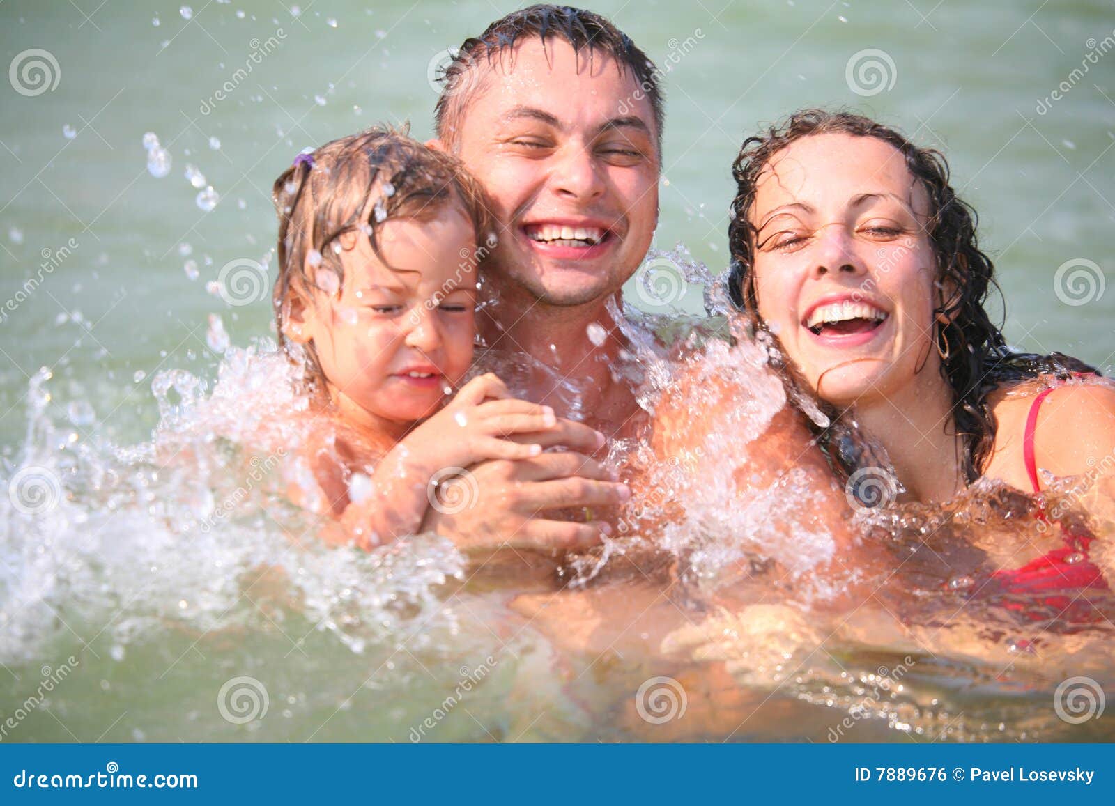 Happy family in sea stock photo. Image of ocean, adult - 7889676