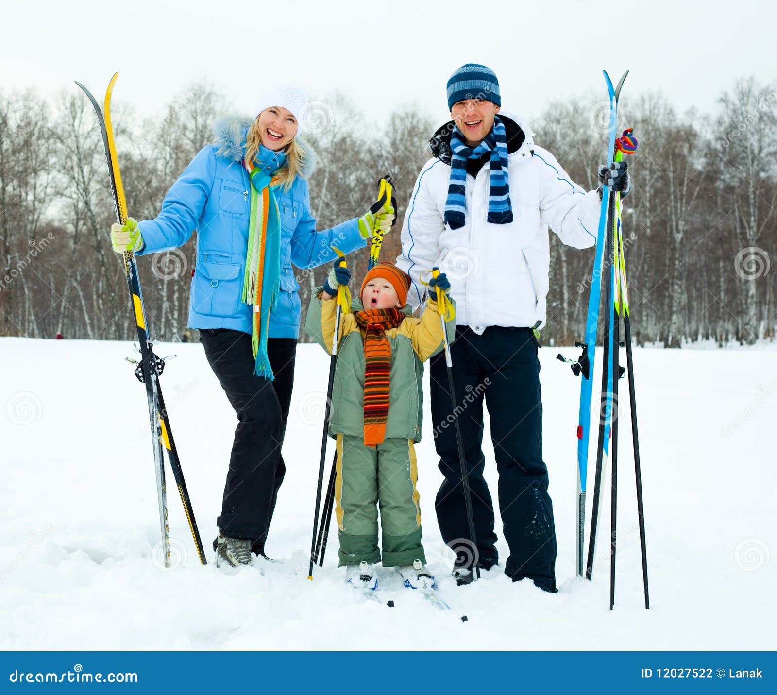 Happy family skiing stock photo. Image of snow, cheerful - 12027522