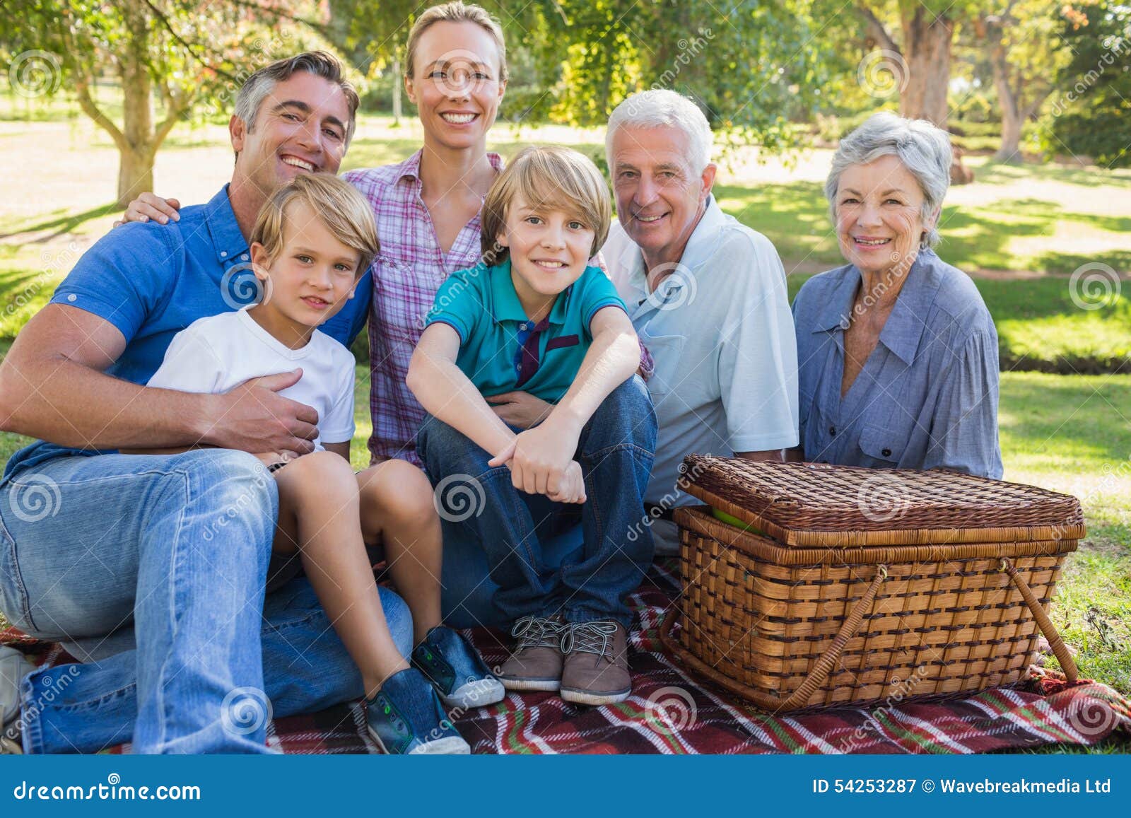 Happy Family Smiling at the Camera Stock Image - Image of grassland ...