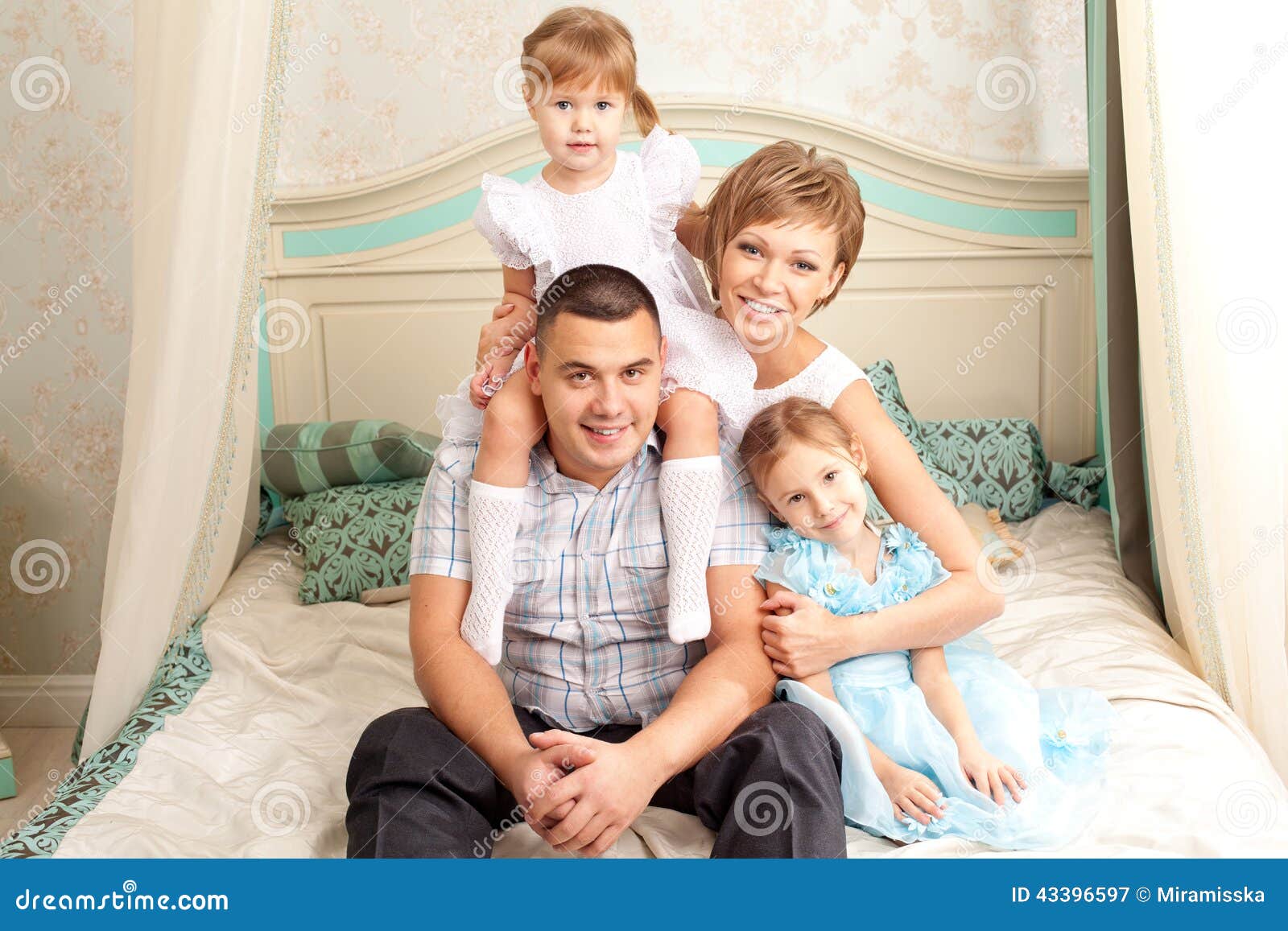 Happy Family Smiling at Home Stock Image - Image of affectionate ...