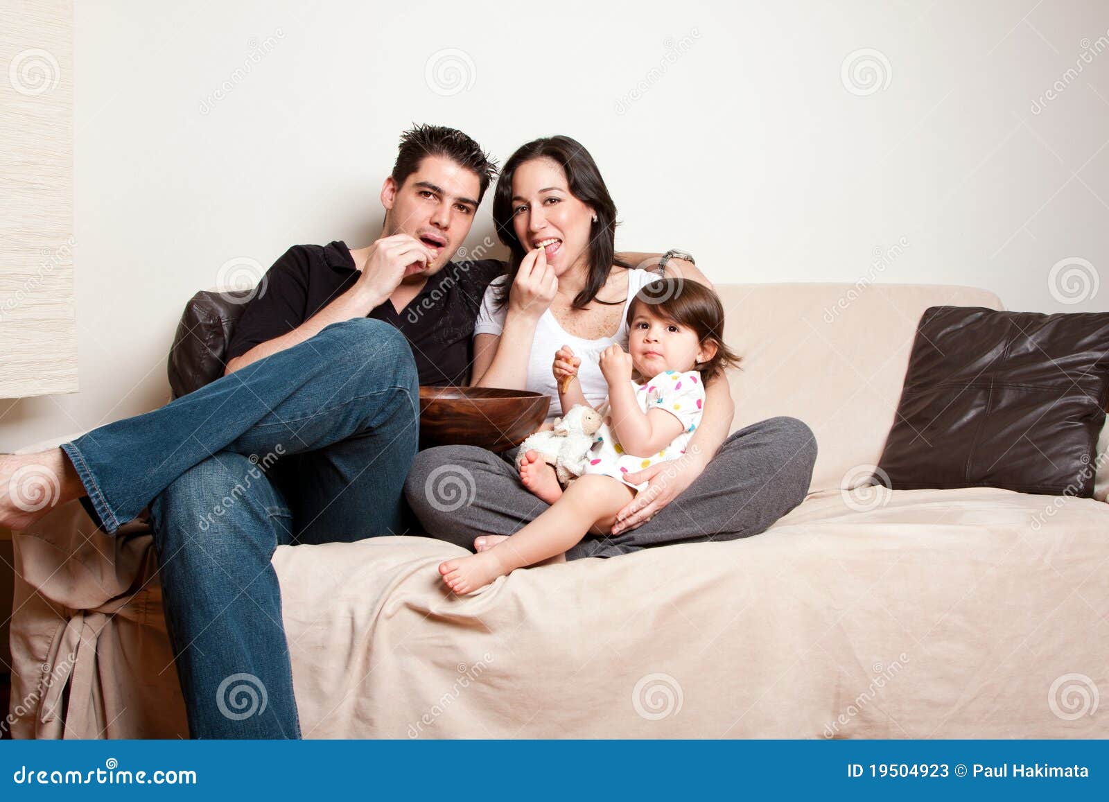 Happy Family Snacking on Sofa Couch Stock Image - Image of child ...