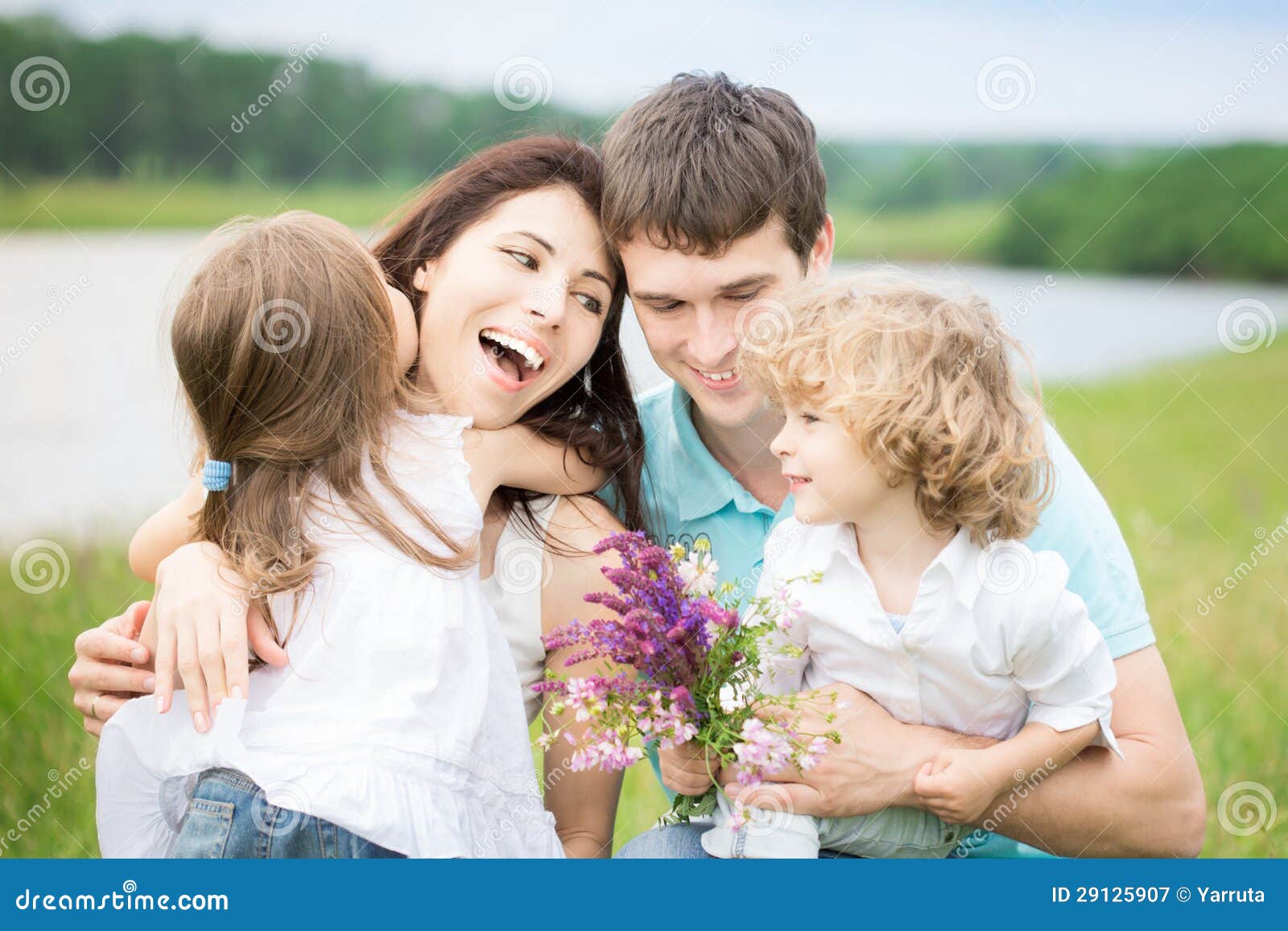 Happy Family in Spring Field Stock Image - Image of casual, cheerful ...