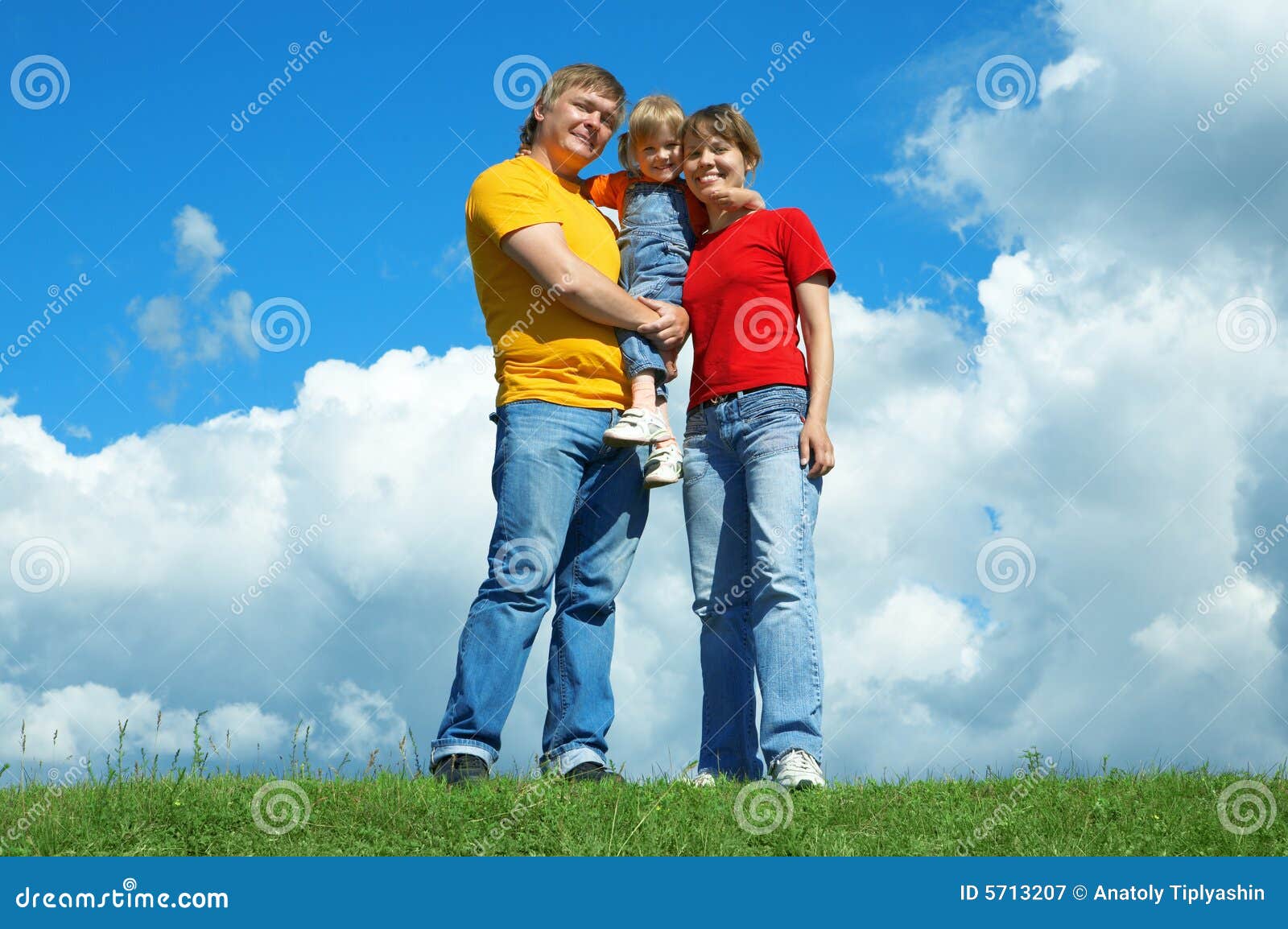 Happy Family Stand on Green Grass Under Sky Stock Image - Image of ...