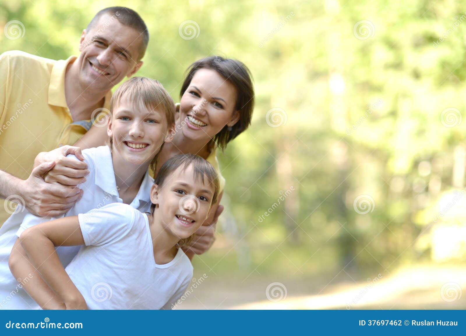 Happy Family in the Summer Park Stock Photo - Image of four, outdoors ...