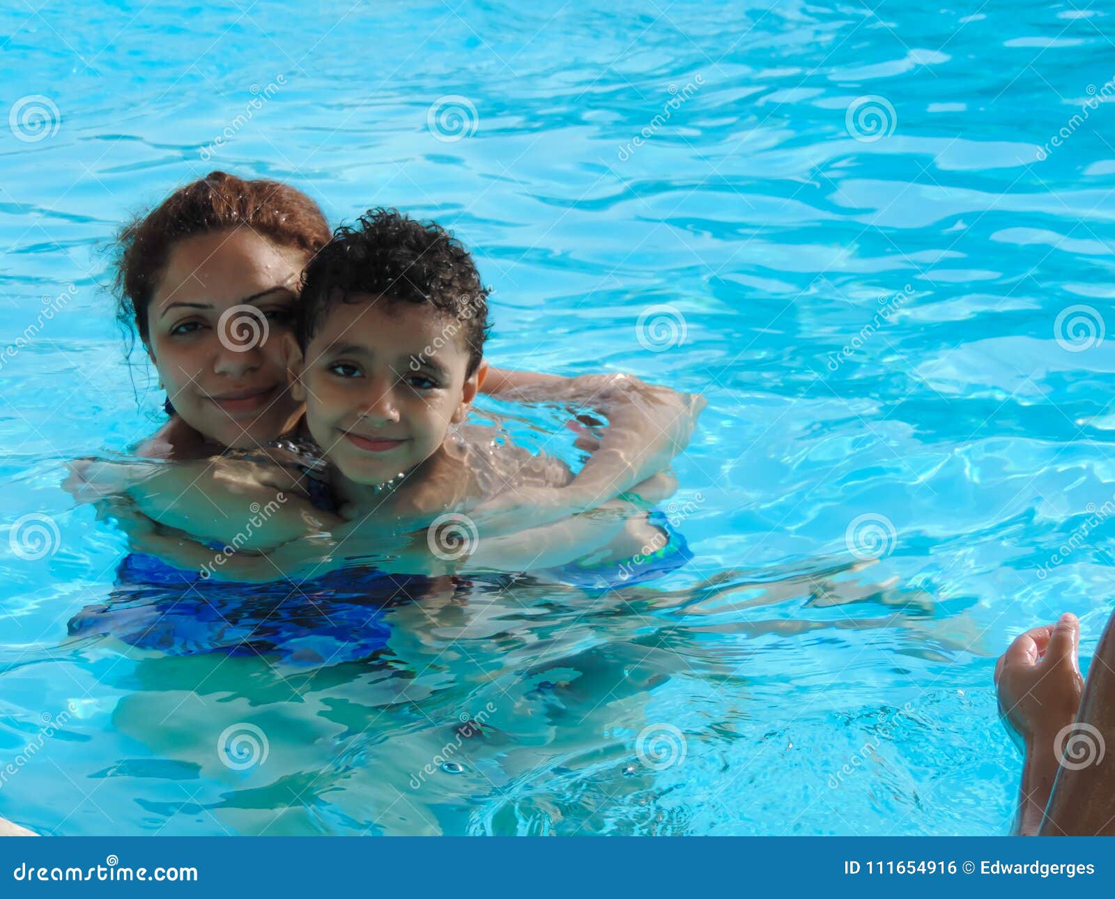 Family at swimming pool stock photo. Image of sport - 111654916