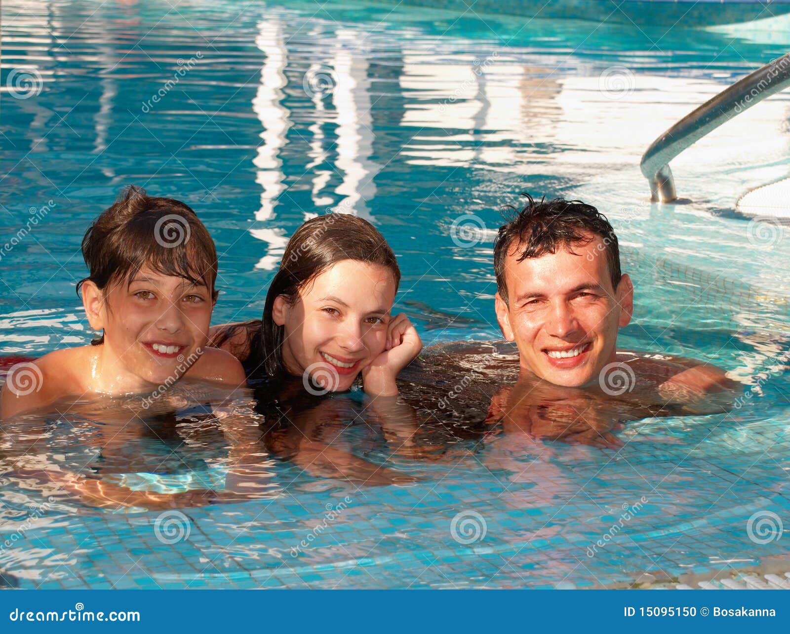 Happy Family in the Swimming Pool Stock Photo - Image of parenthood ...