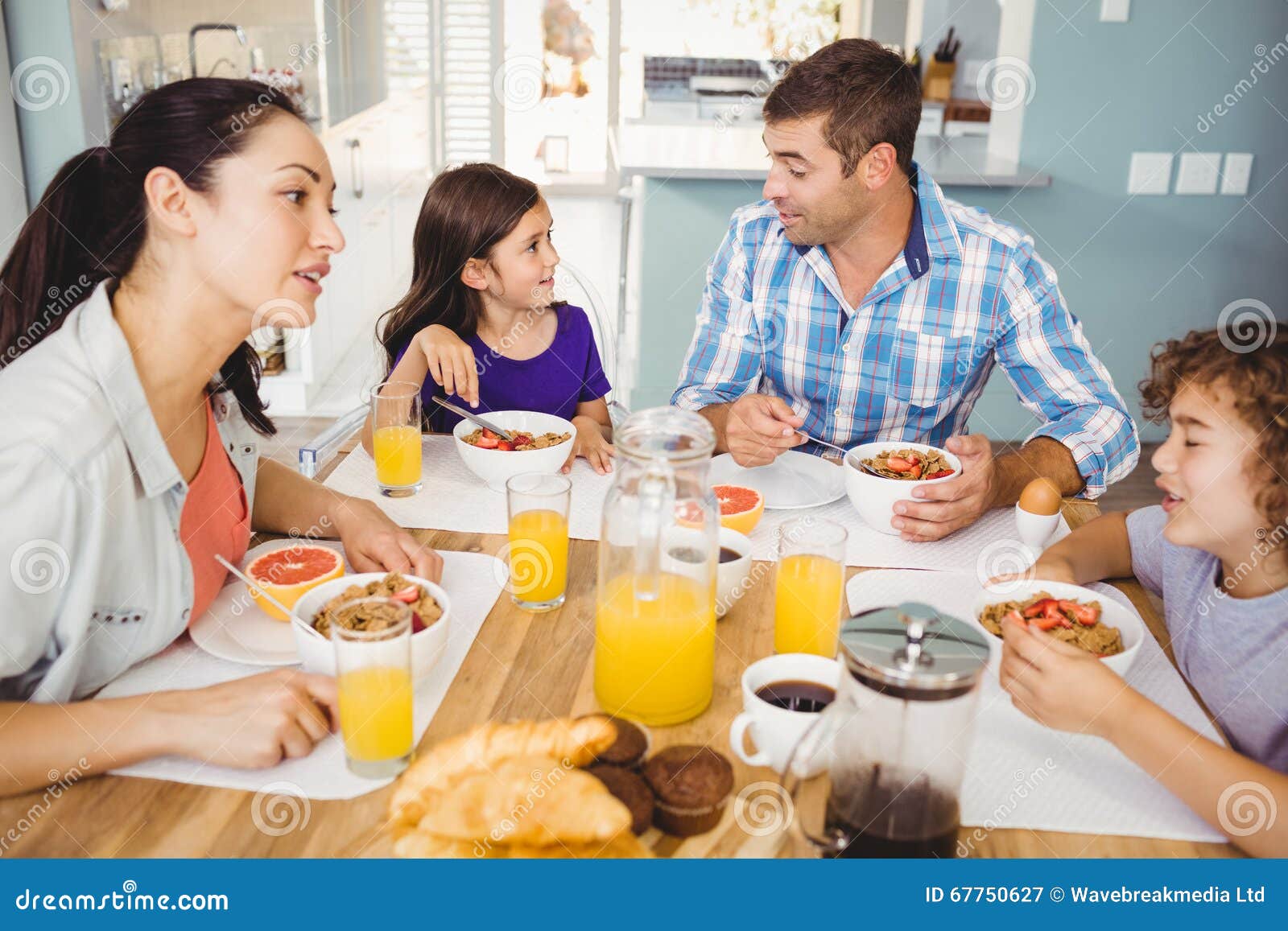 Happy Family Talking while Having Breakfast Stock Image - Image of ...