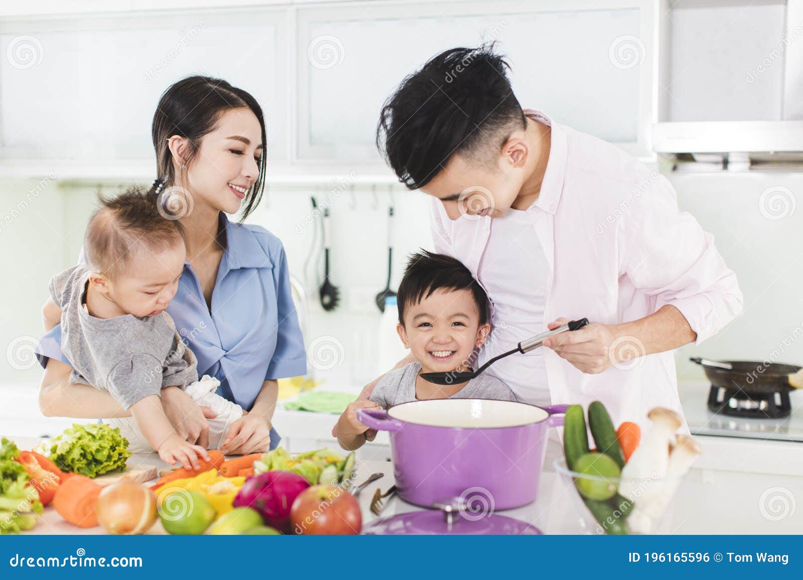 Happy Family Tasting the Soup in Kitchen Stock Photo - Image of asian ...