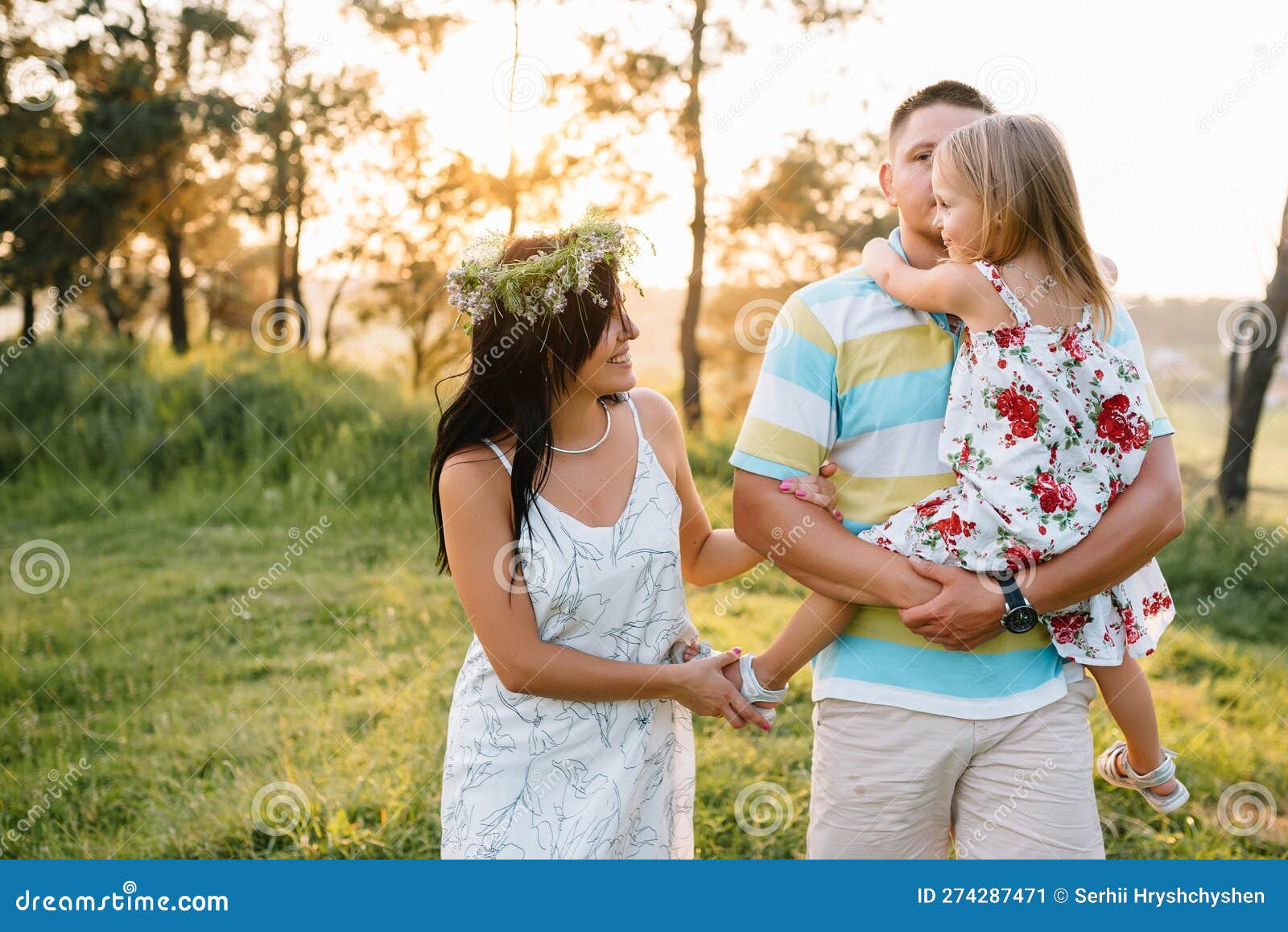 Happy Family of Three Persons Walking the Grass in the Park. Stock ...