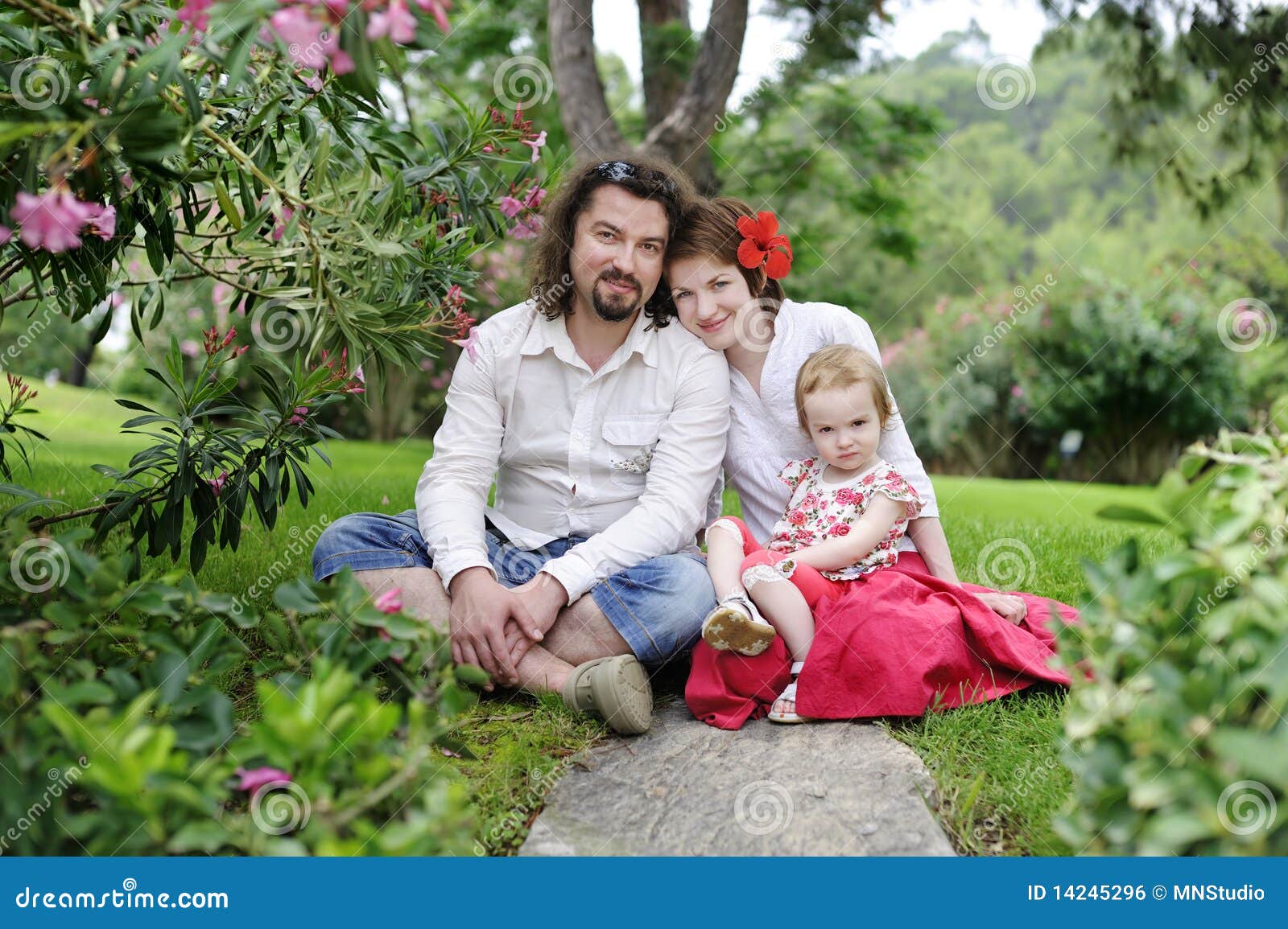 Happy Family in a Tropical Scenery Stock Photo - Image of flowers ...