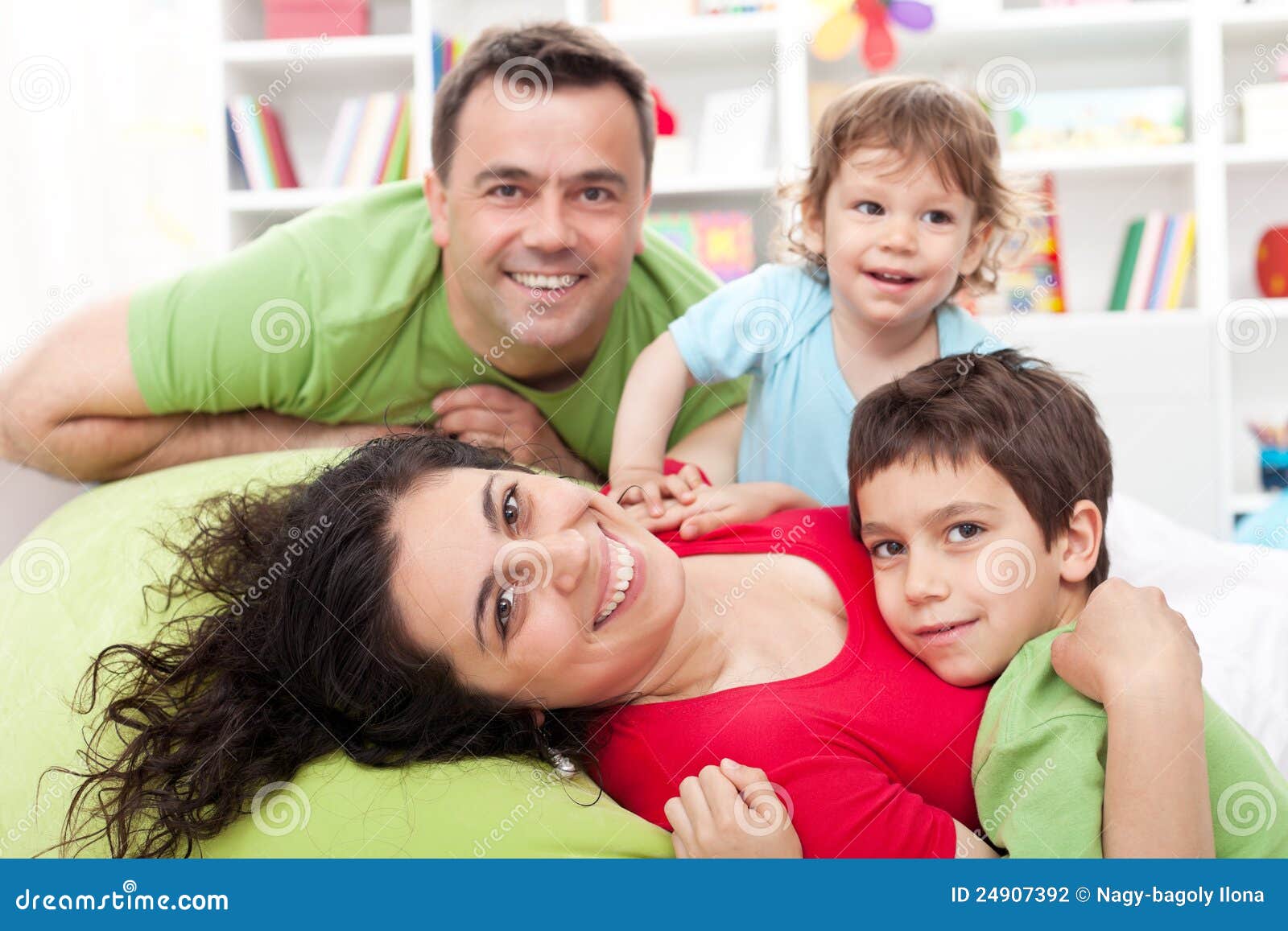 Happy family with two kids stock photo. Image of family - 24907392