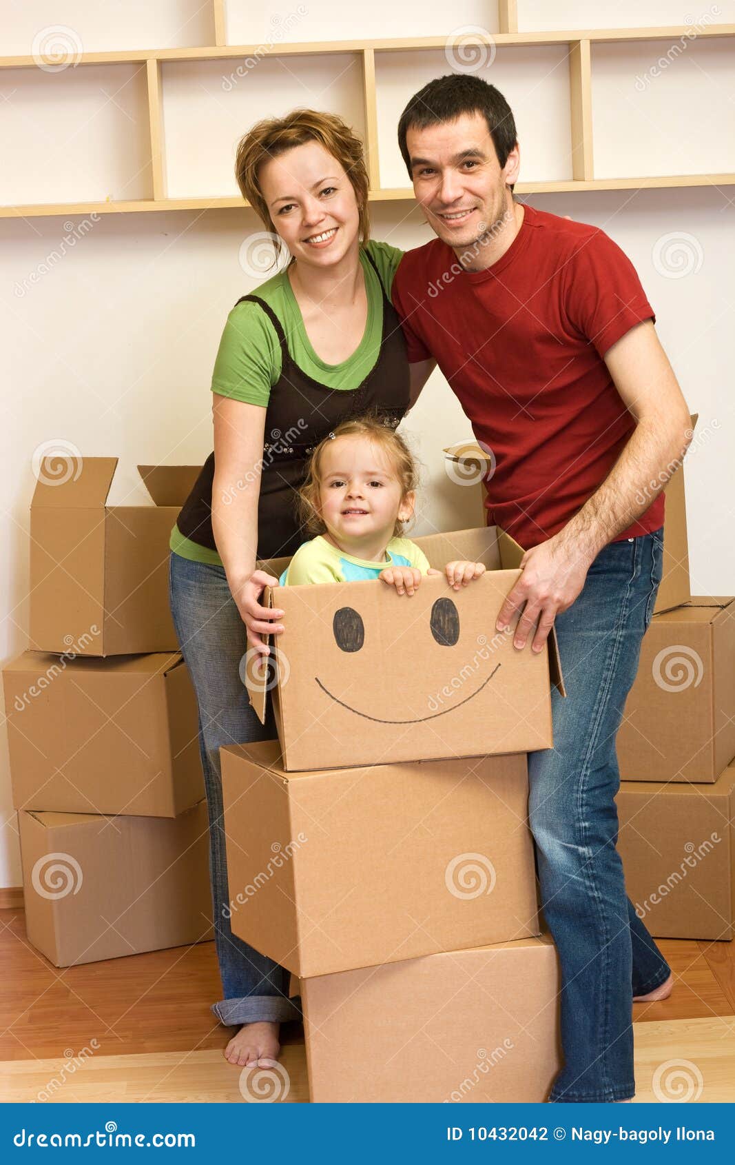 Happy Family Unpacking in a New Home Stock Photo - Image of indoors ...