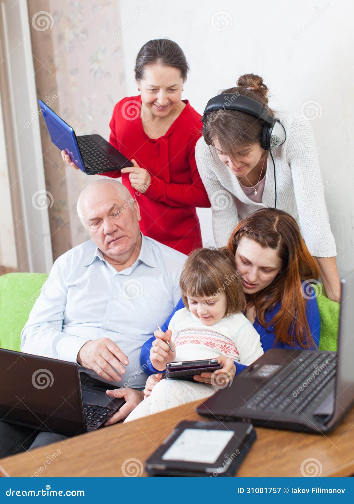 Happy Family Uses Few Electronic Devices Stock Image - Image of ...