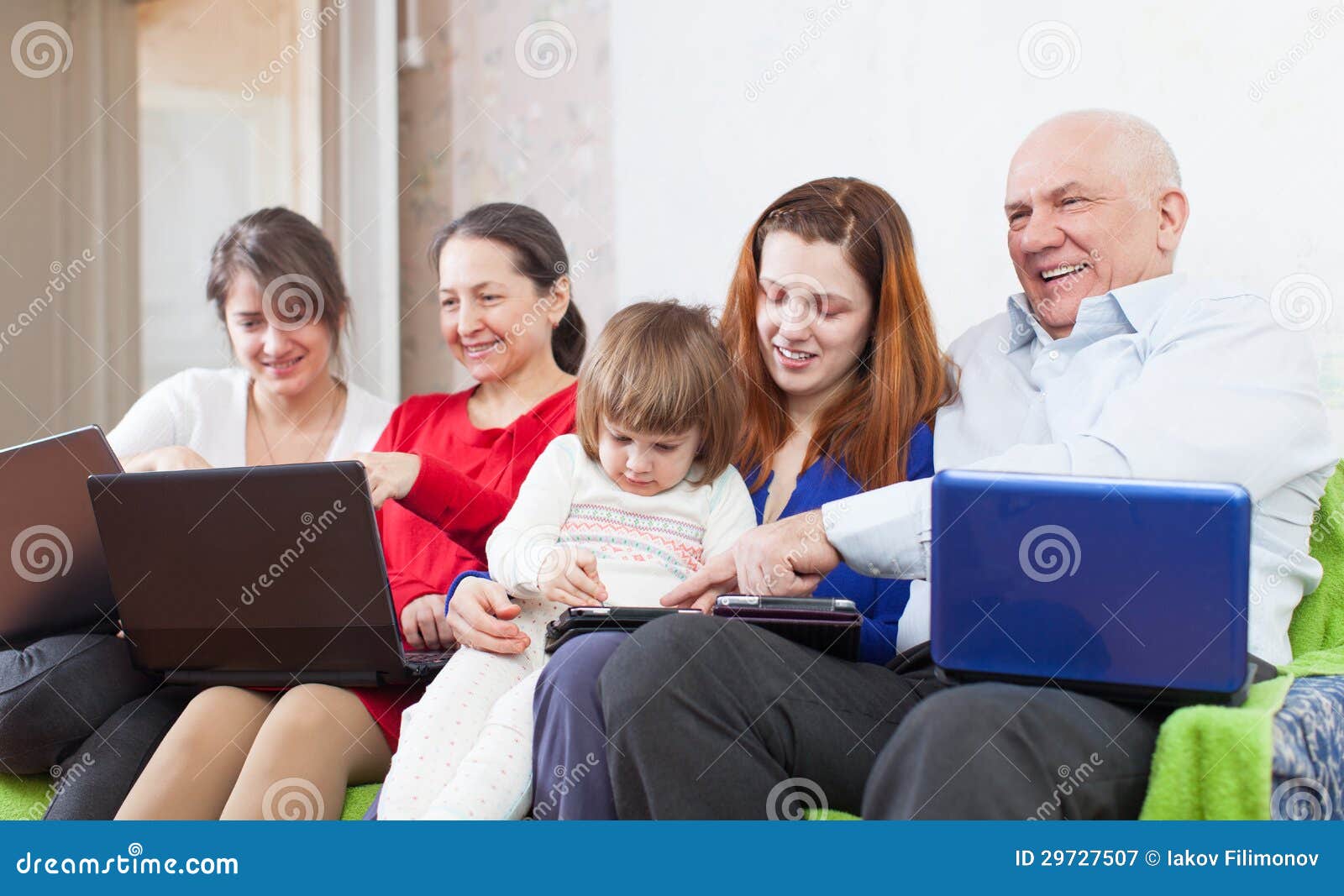Family Uses Electronic Devices Together Stock Image - Image of ...