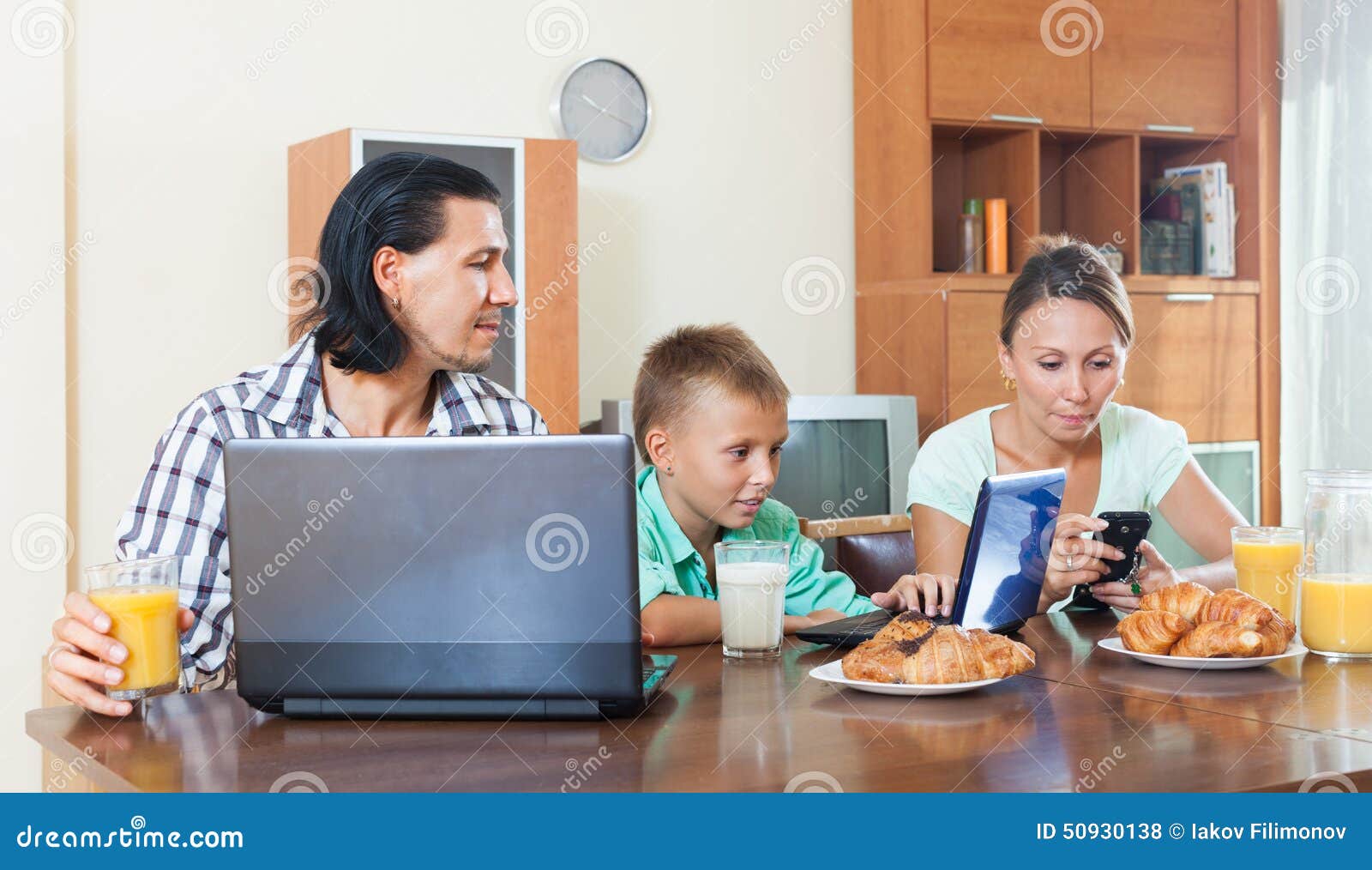 Happy Family Using Electronic Devices Stock Photo - Image of internet ...
