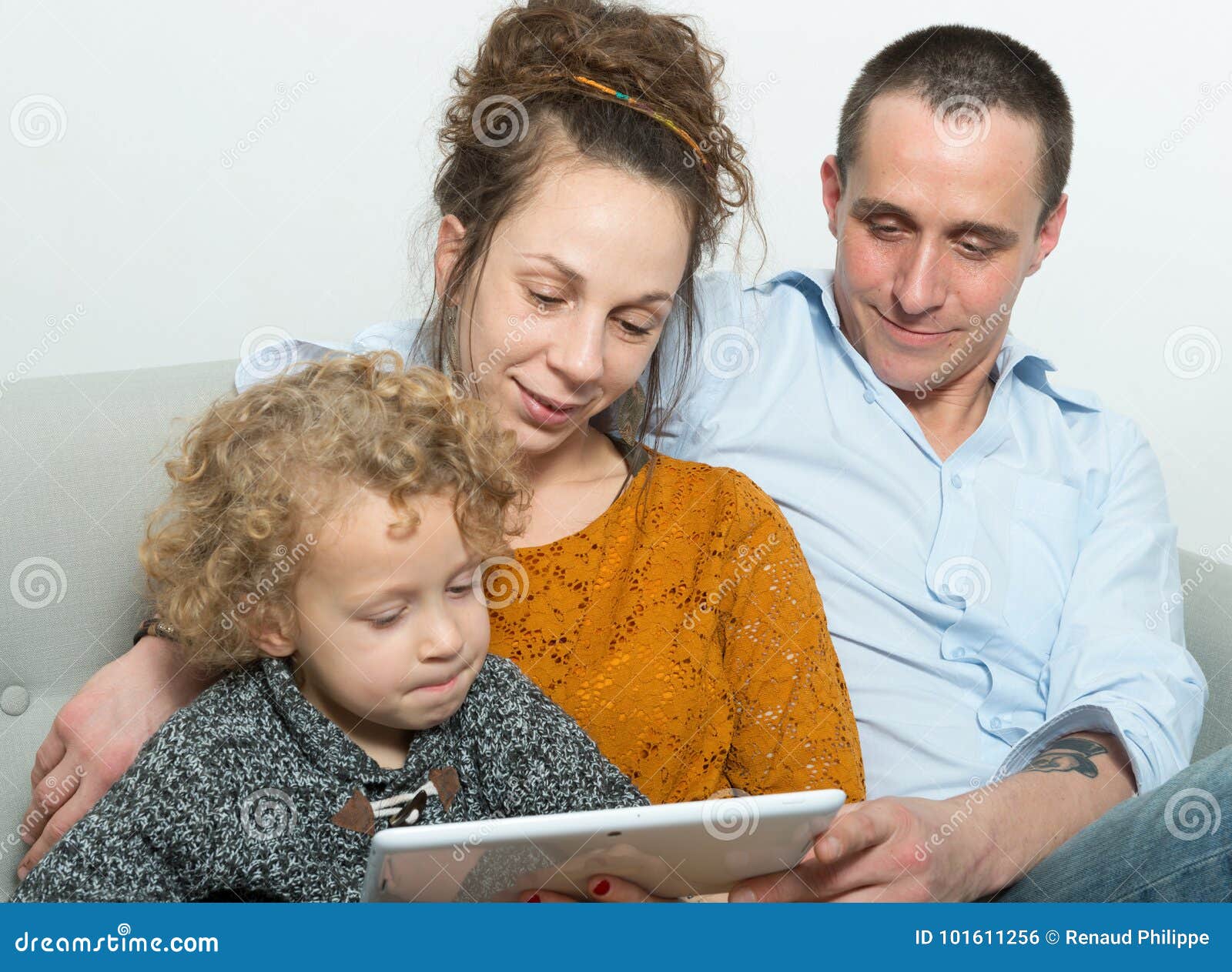 Happy Family Using a Tablet Stock Photo - Image of internet, little ...