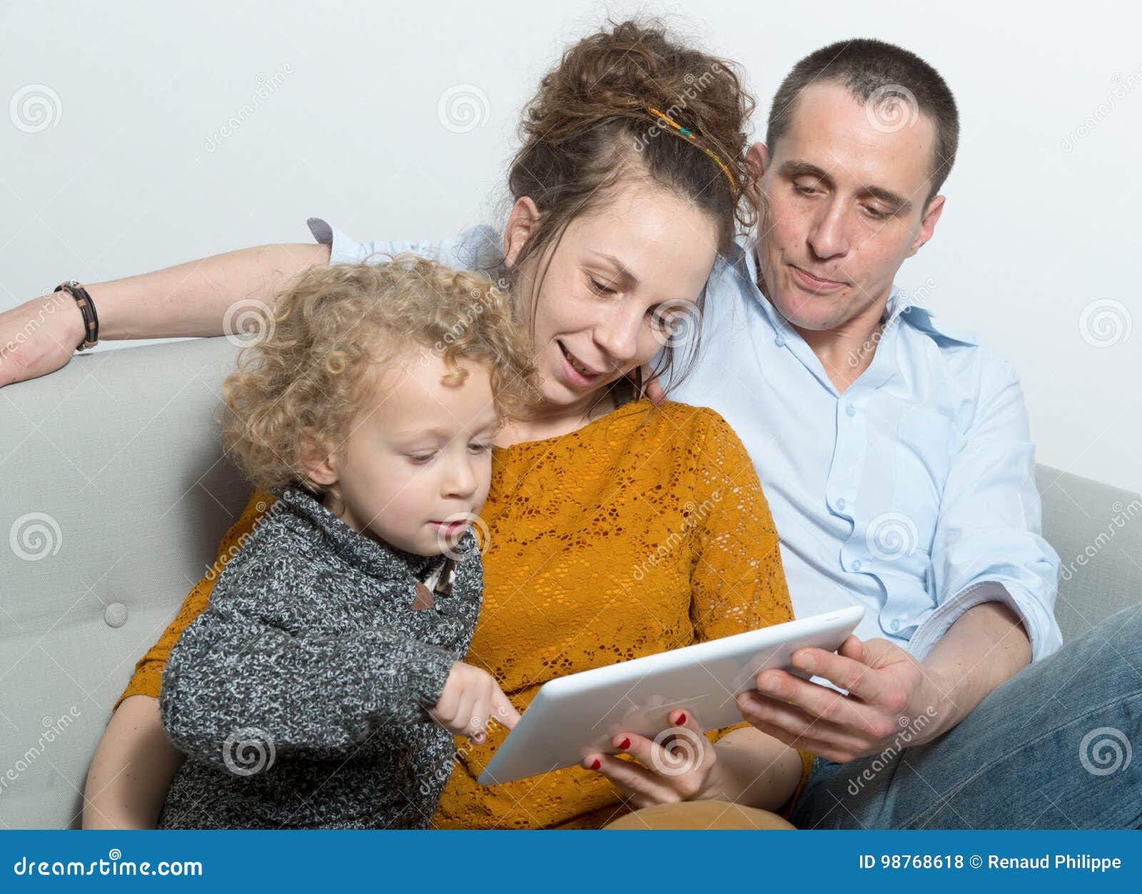 Happy Family Using a Tablet Stock Photo - Image of father, children ...