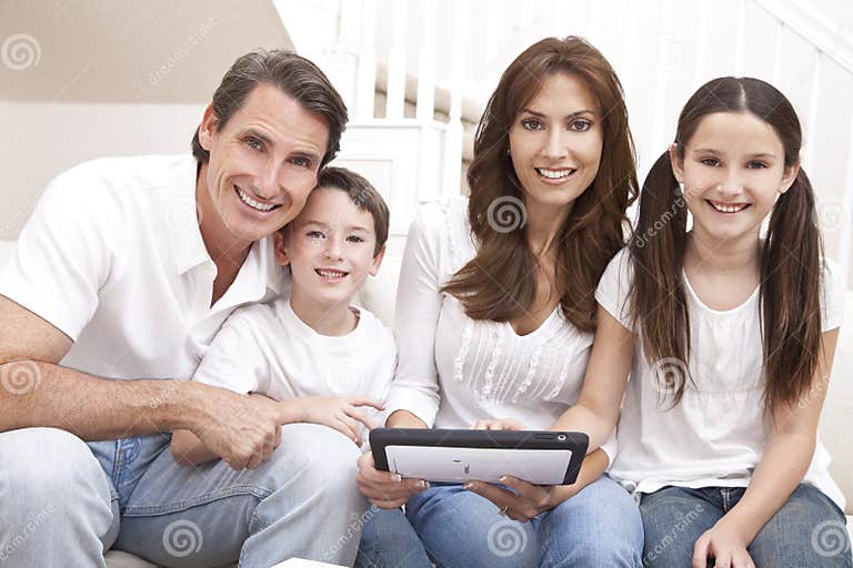 Happy Family Using Tablet Computer at Home Stock Photo - Image of ...