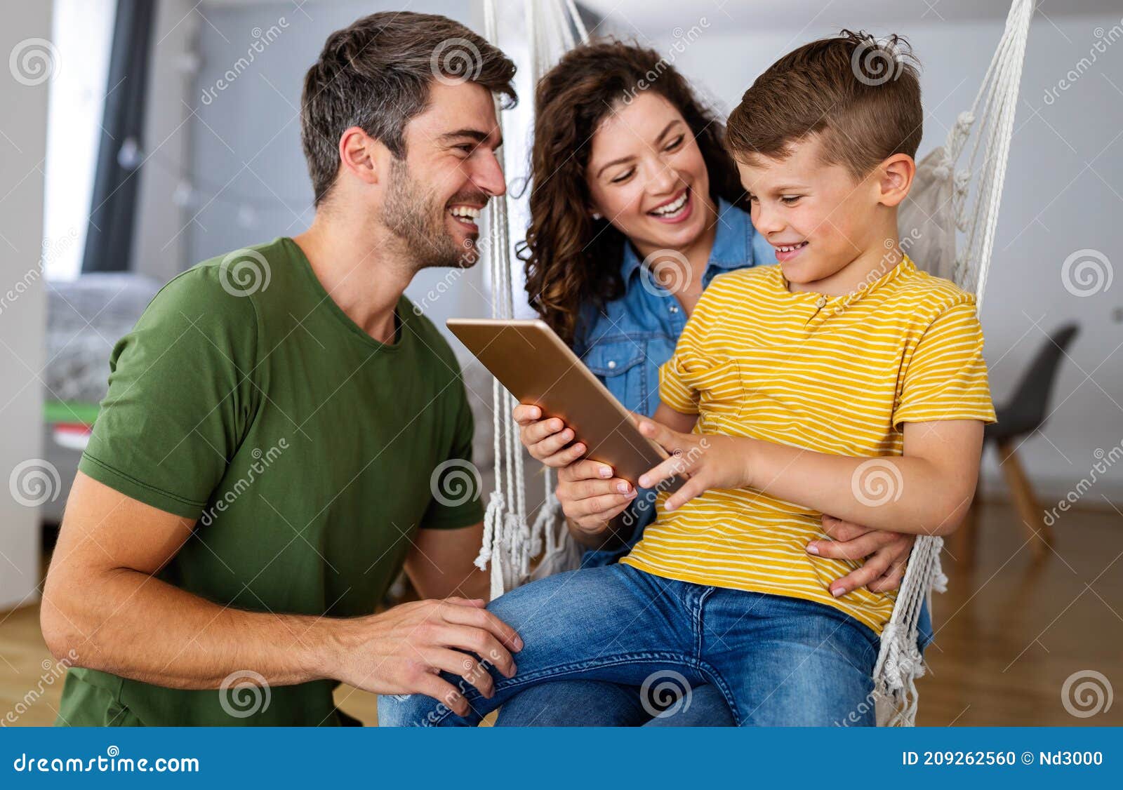 Happy Family Using Technology Devices Together at Home. Stock Photo ...