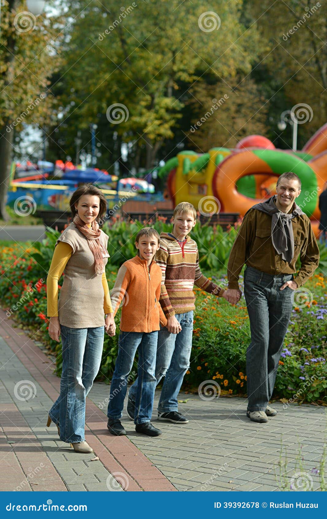 Happy family on a walk stock photo. Image of amusement - 39392678