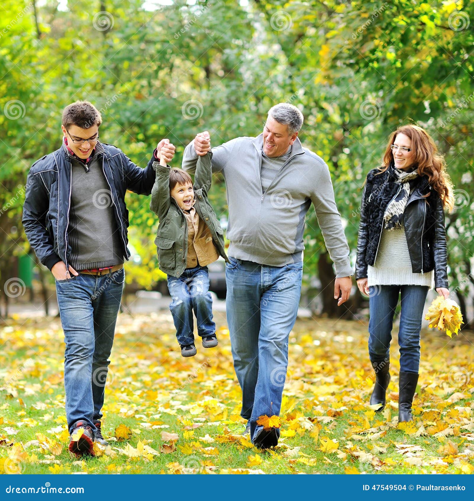 Happy Family Walking Together in a Park Stock Photo - Image of nature ...