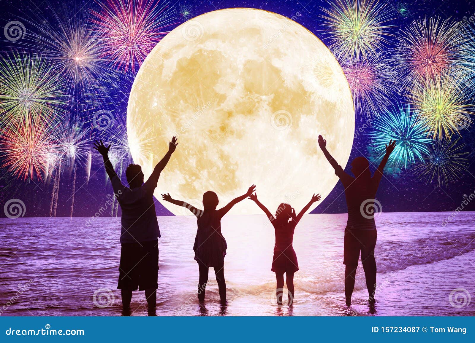 Family Watching the Moon and Fireworks on the Beach Stock Image - Image ...
