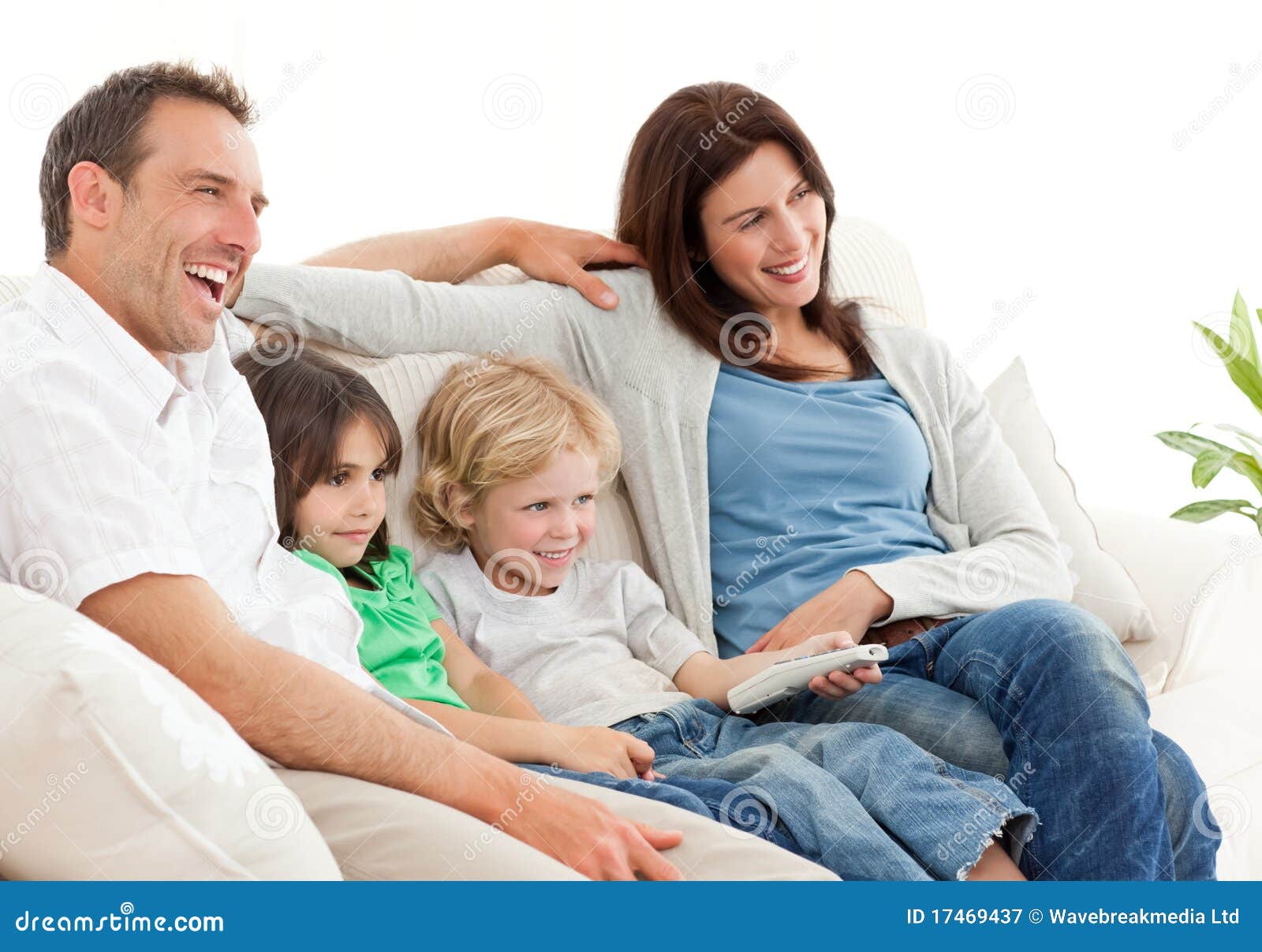 Happy Family Watching Television Together Stock Image - Image of father ...