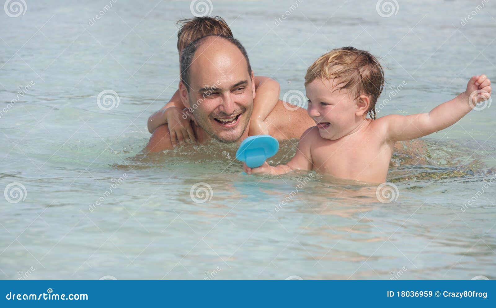 Happy family in water stock image. Image of parent, playful - 18036959