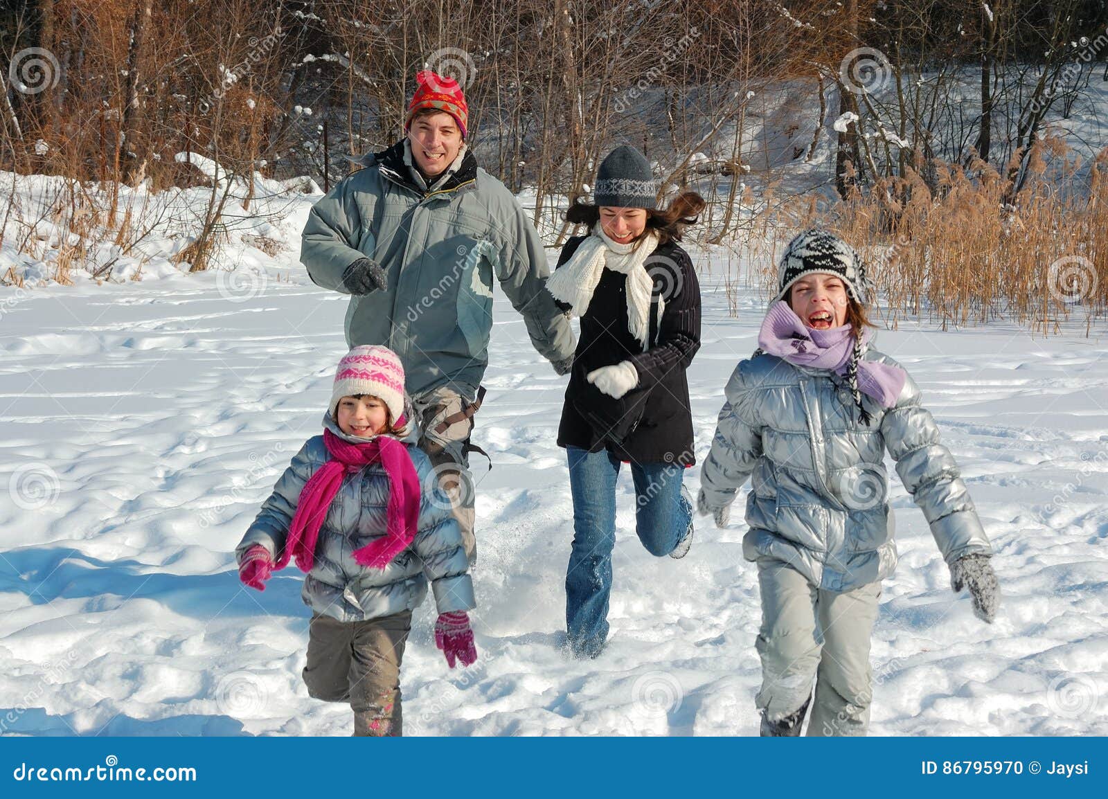 Happy Family in Winter, Having Fun with Snow Outdoors Stock Photo ...
