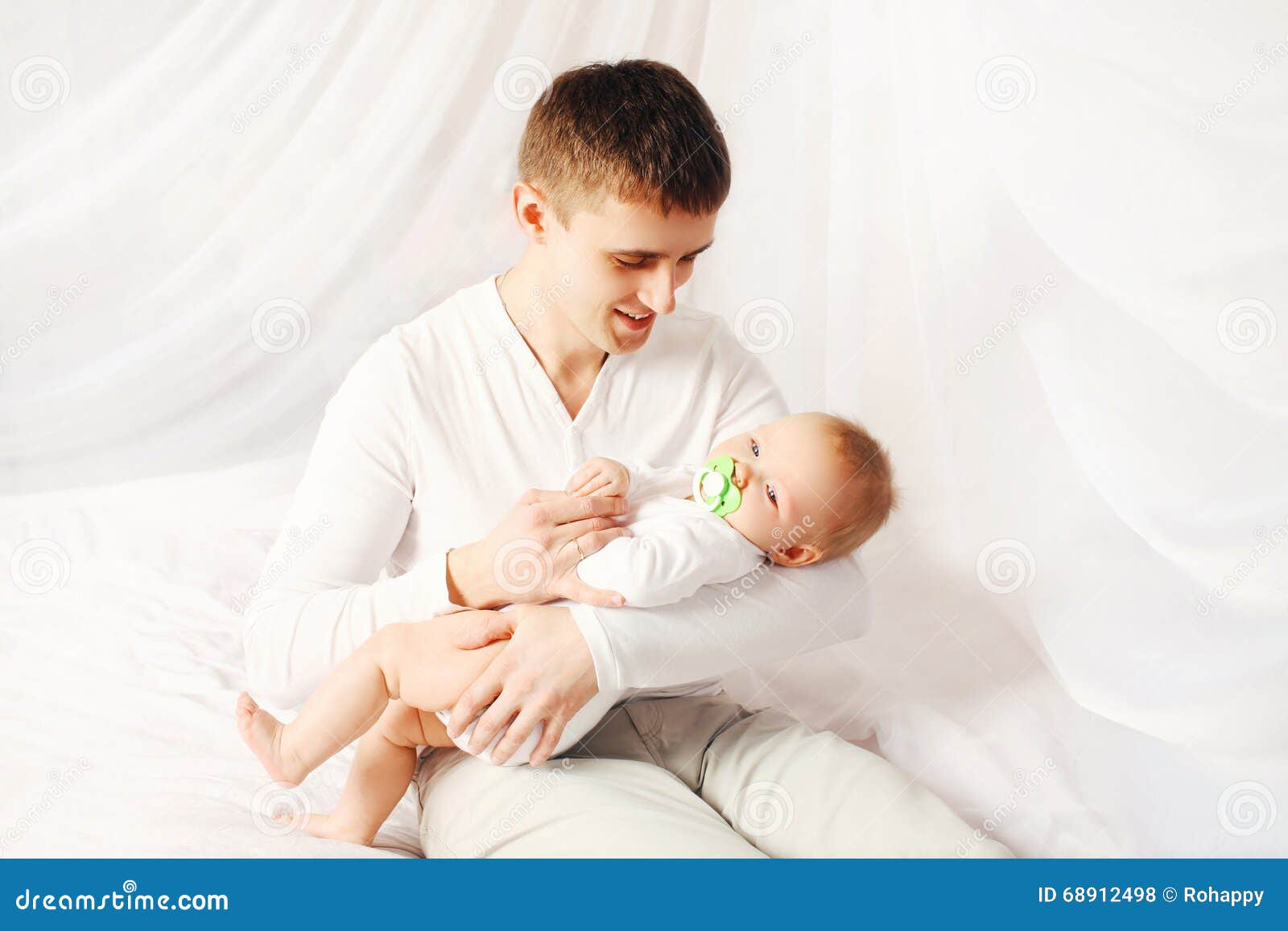 Happy Father with Baby on Bed Home Bedtime Stock Photo - Image of ...