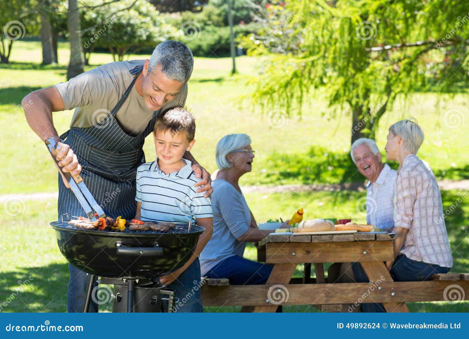 Happy Father Doing Barbecue with His Son Stock Photo - Image of male ...