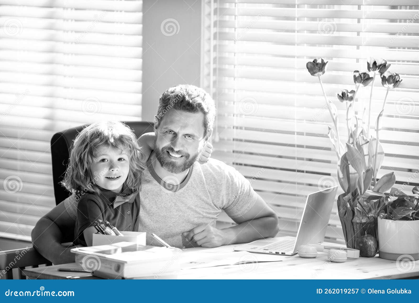 Happy Father Helping His School Child Study with Writing and Laptop ...