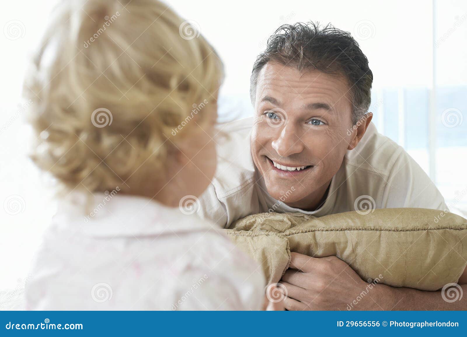 Happy Father Looking at Son Stock Photo - Image of male, cushion: 29656556