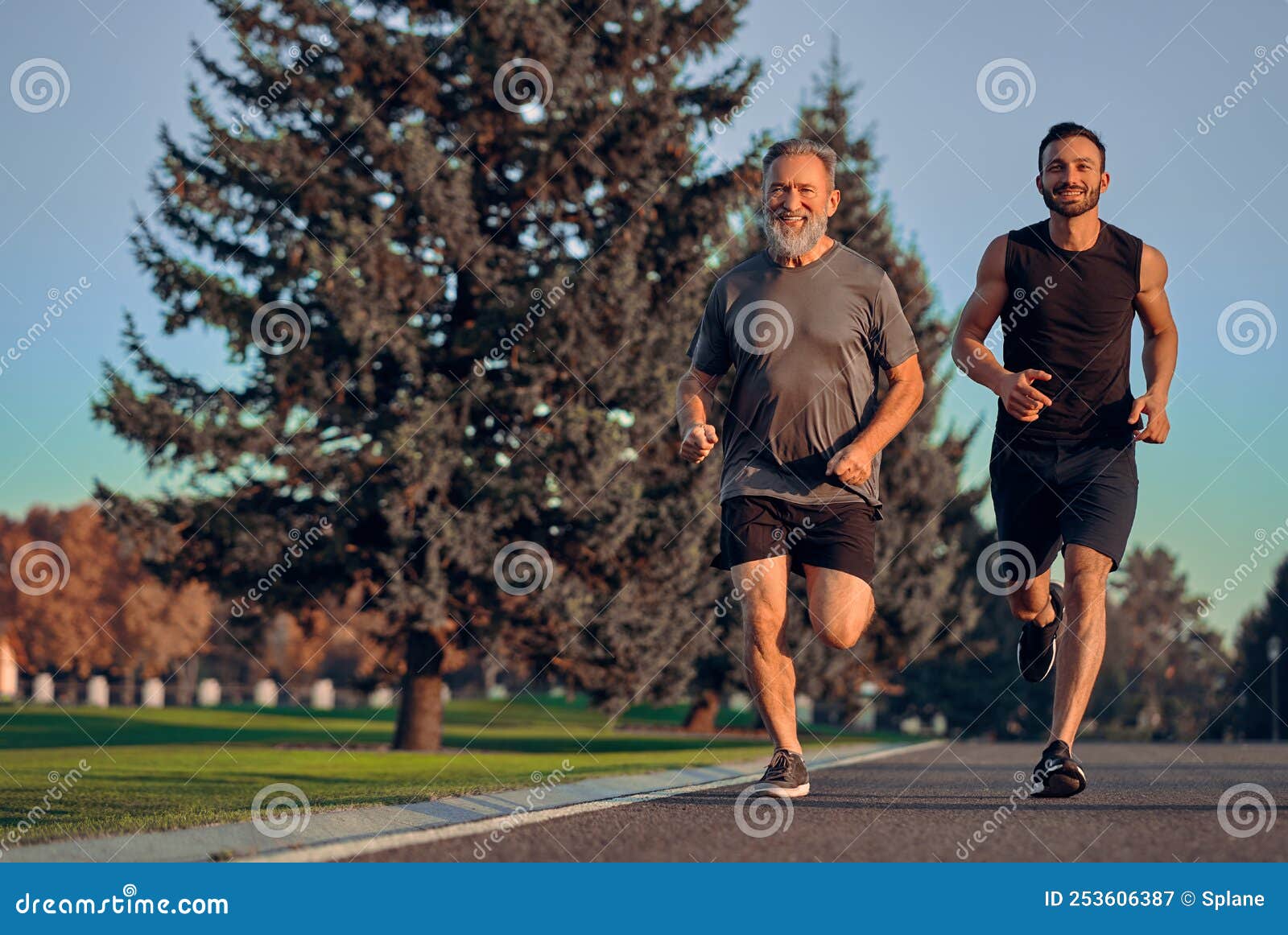 The Happy Father and Son Running on the Road. Stock Image - Image of ...