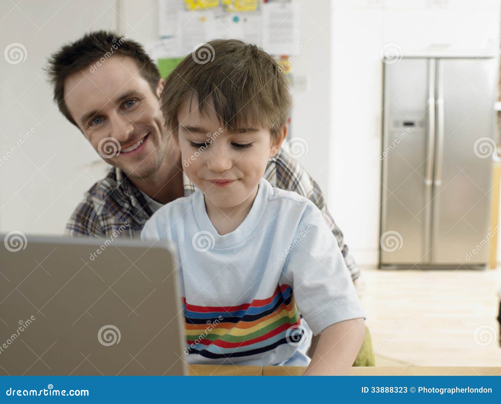 Happy Father with Son Using Laptop at Home Stock Image - Image of ...