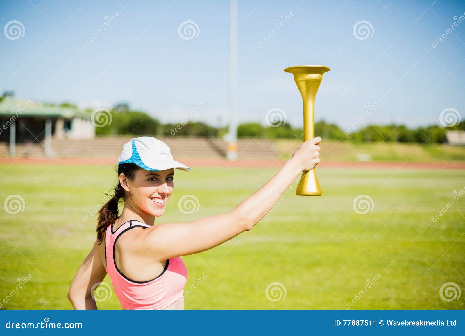 Happy Female Athlete Holding a Fire Torch Stock Image - Image of ... Happy Female Athlete Holding a Fire Torch Stock Image - Image of ...