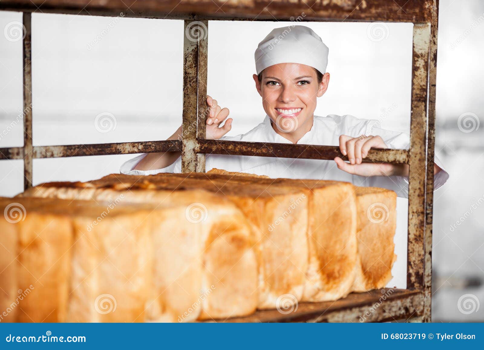 Happy Female Baker Pushing Bread Rack Stock Image - Image of baking ...