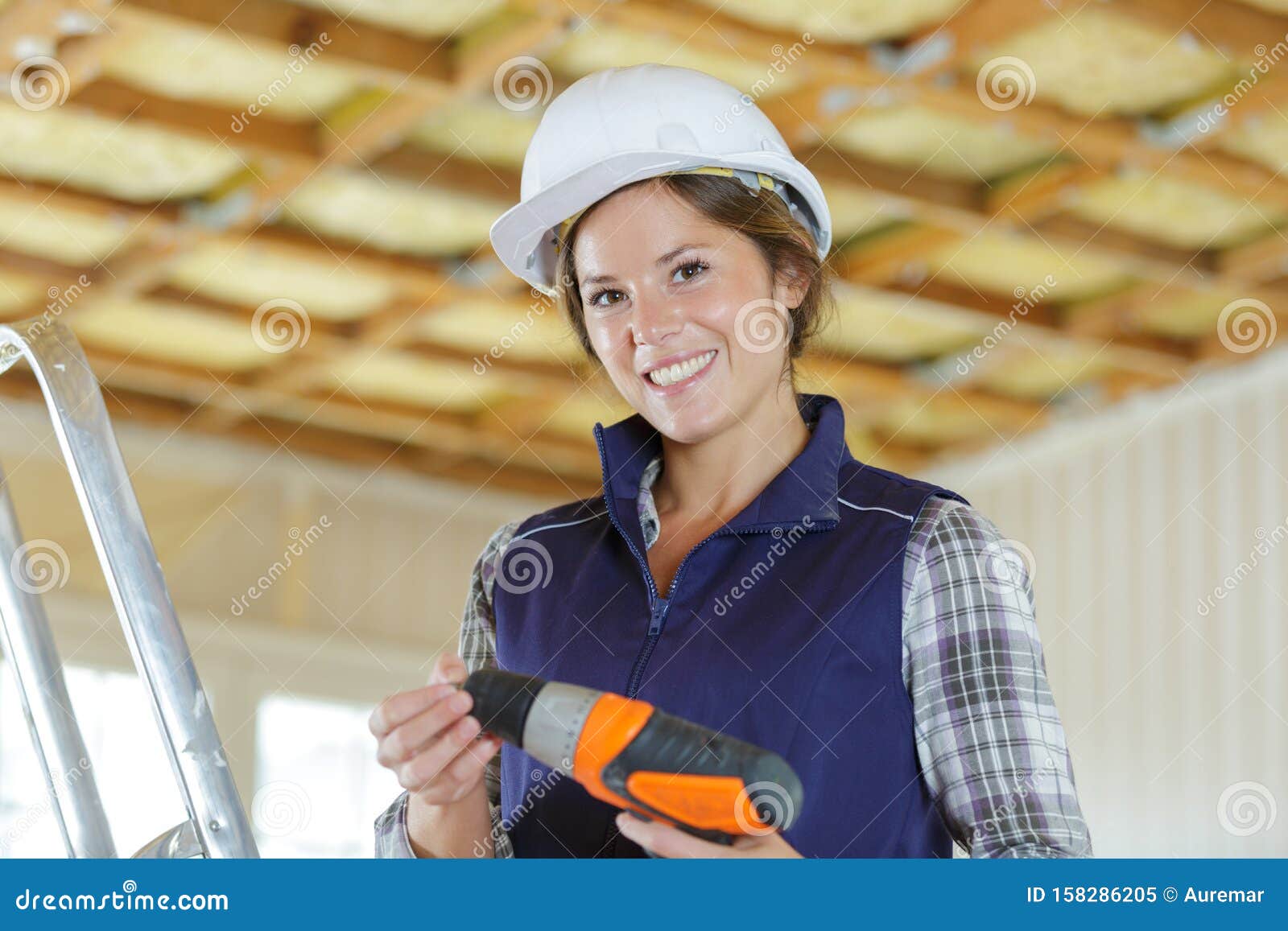 Happy Female Builder Holding Drill Stock Image - Image of indoor ...