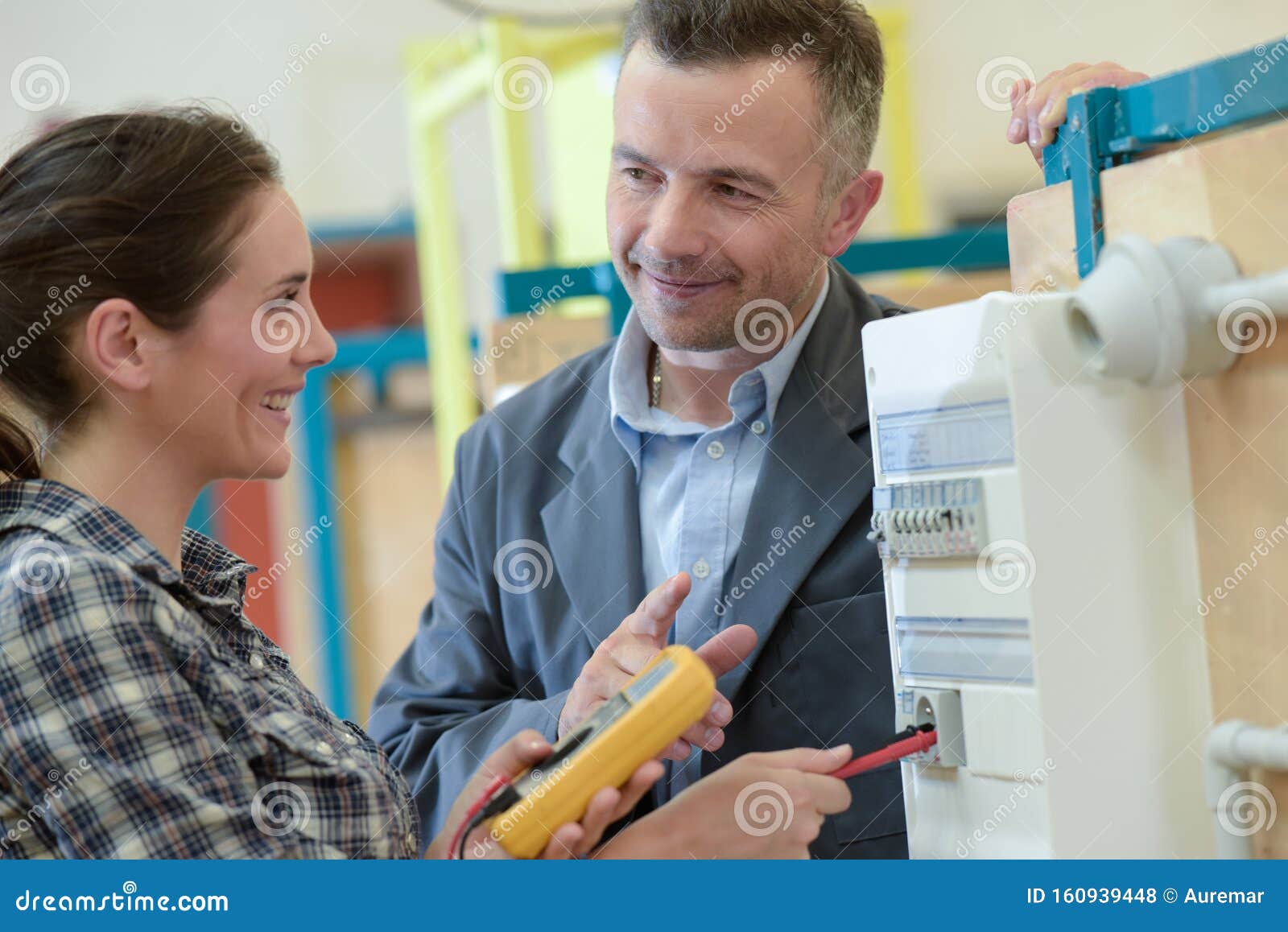 Happy Female Electrician Using Multimeter Stock Photo - Image of female ...