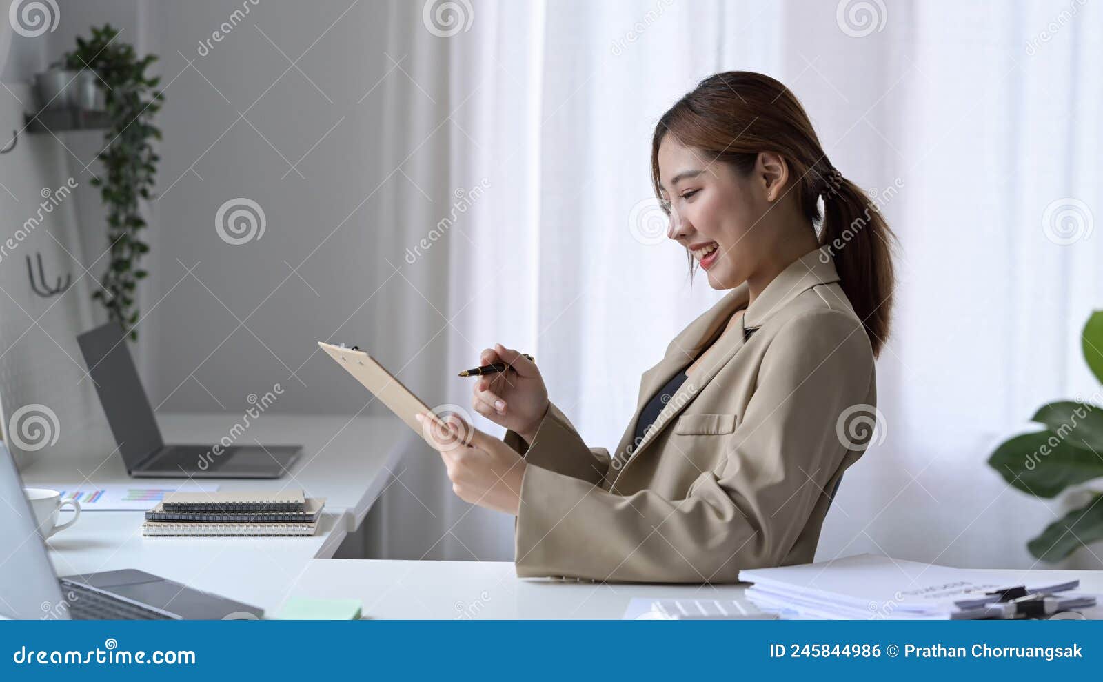 Happy Female Employee Working in Comfortable Workplace. Stock Photo ...