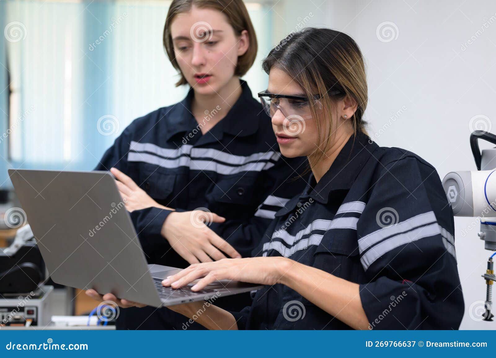 Happy Female Engineers Team Using Laptop Checking and Operating Stock ...