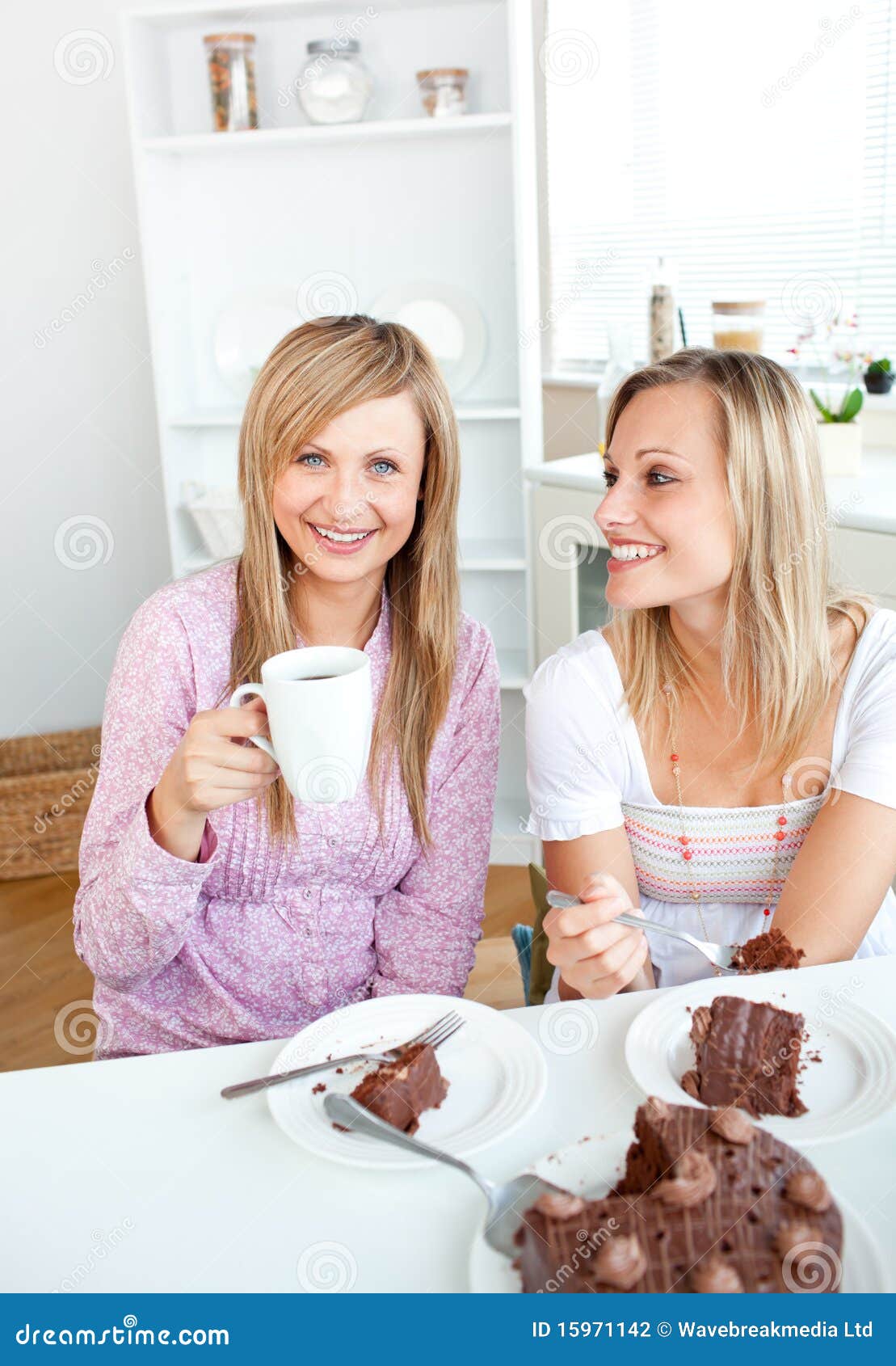 Happy Female Friends Eating a Cake and Drinking Stock Photo - Image of ...