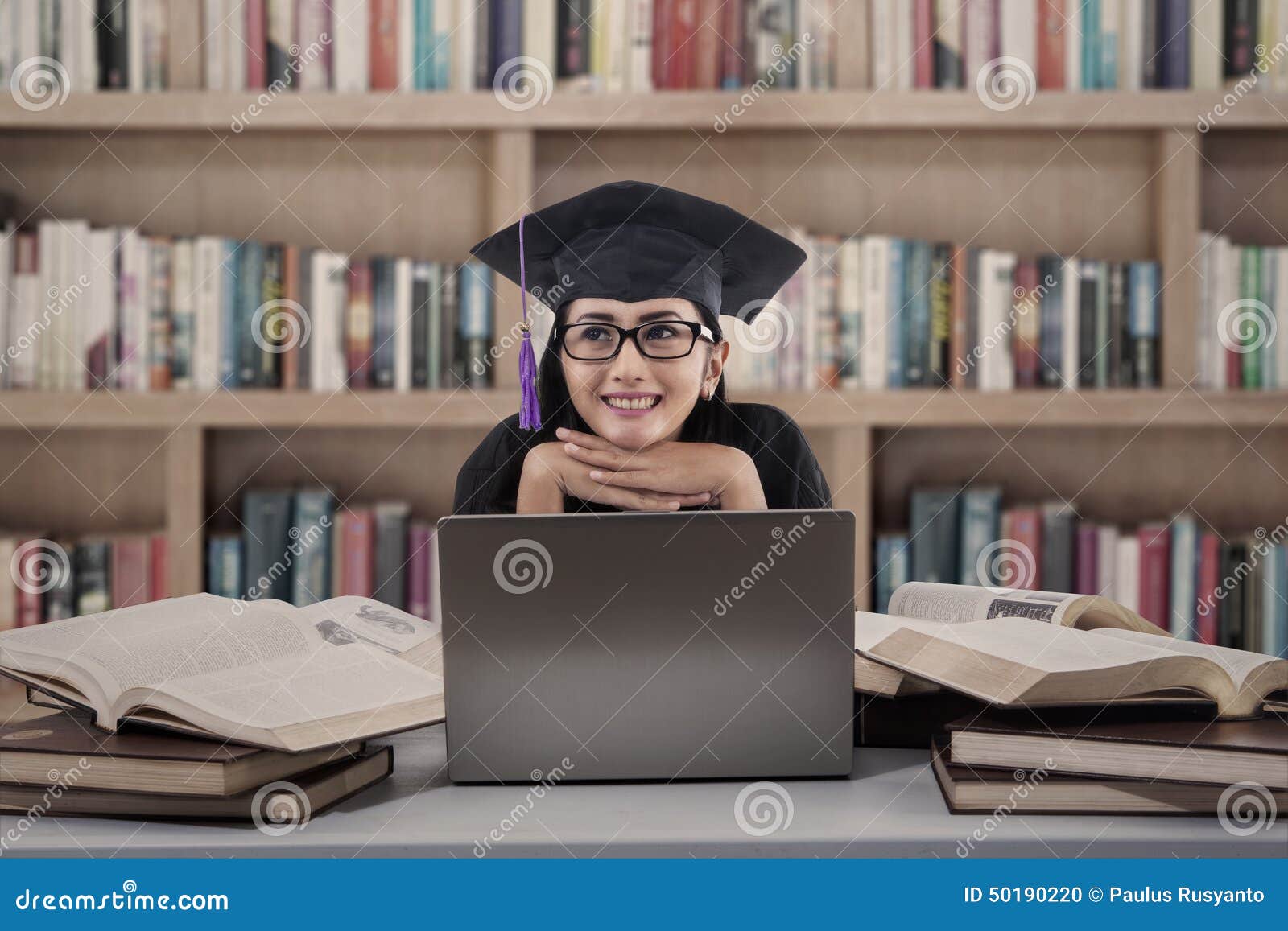 Happy Female Graduate Thinking at Library Stock Photo - Image of happy ...