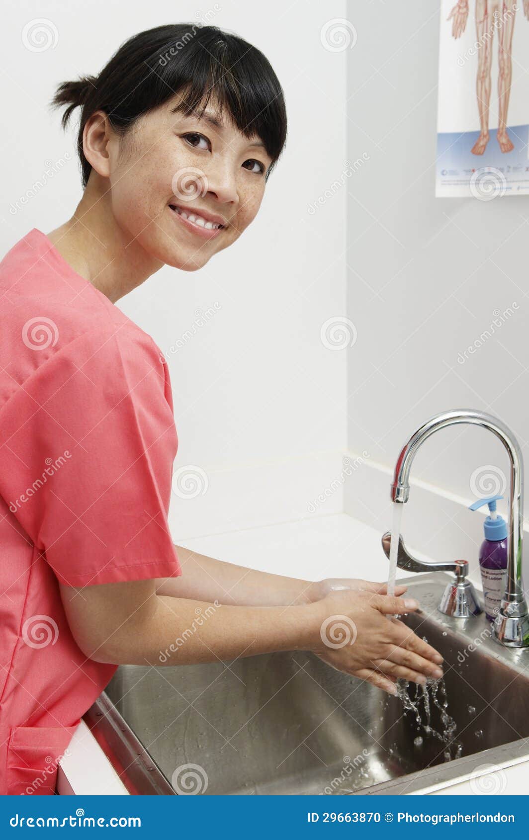 Happy Female Nurse Washing Hands Stock Photo - Image of happiness, care ...