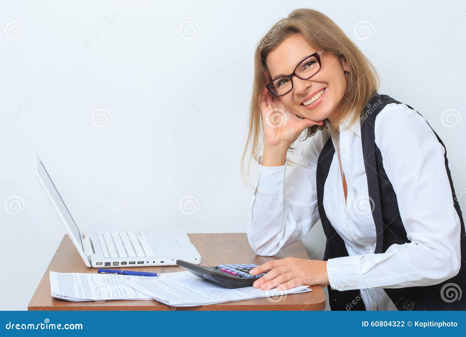Happy Female Office Worker Sits at Her Desk and Stock Photo - Image of ...