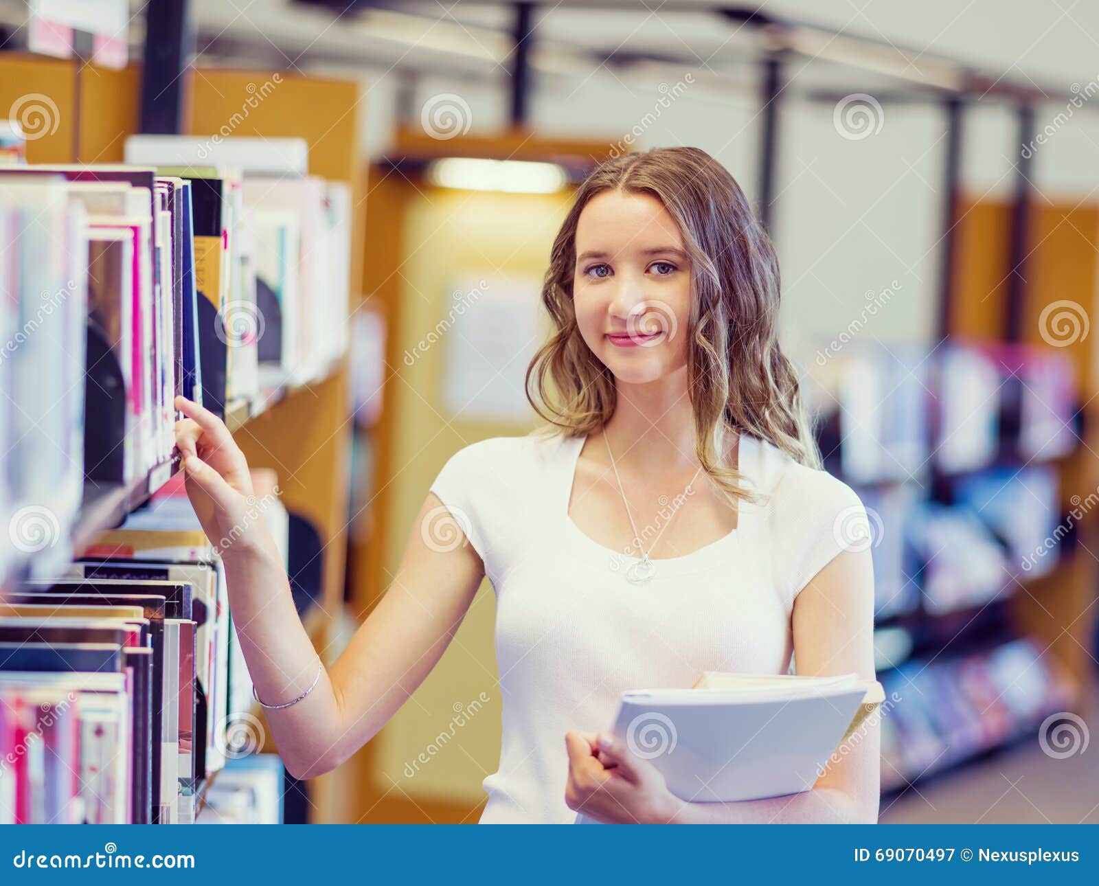 Happy Female Student Holding Books at the Library Stock Image - Image ...
